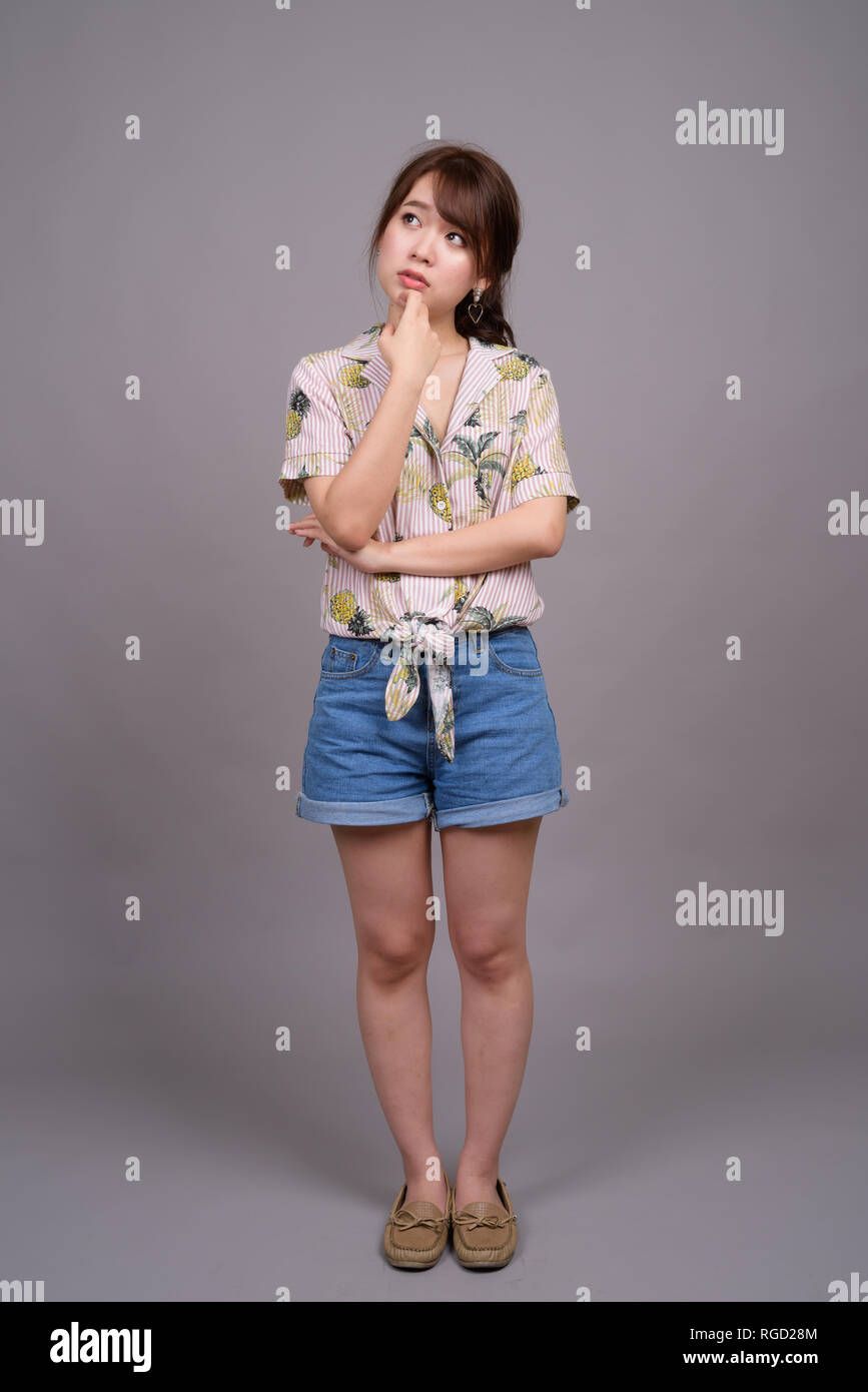 Full length portrait of beautiful young Asian woman standing Stock ...