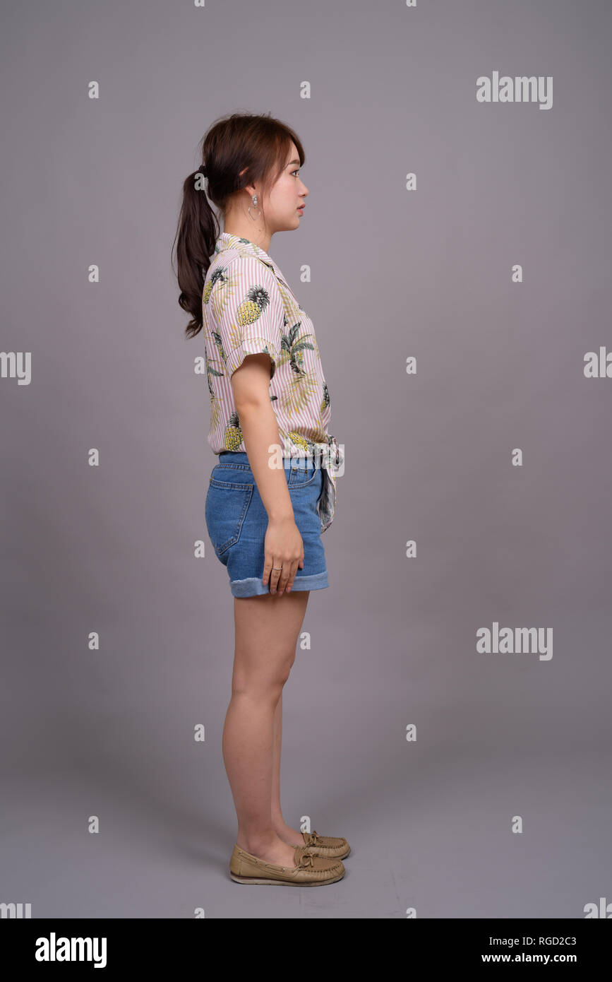 Full length portrait of beautiful young Asian woman standing Stock ...
