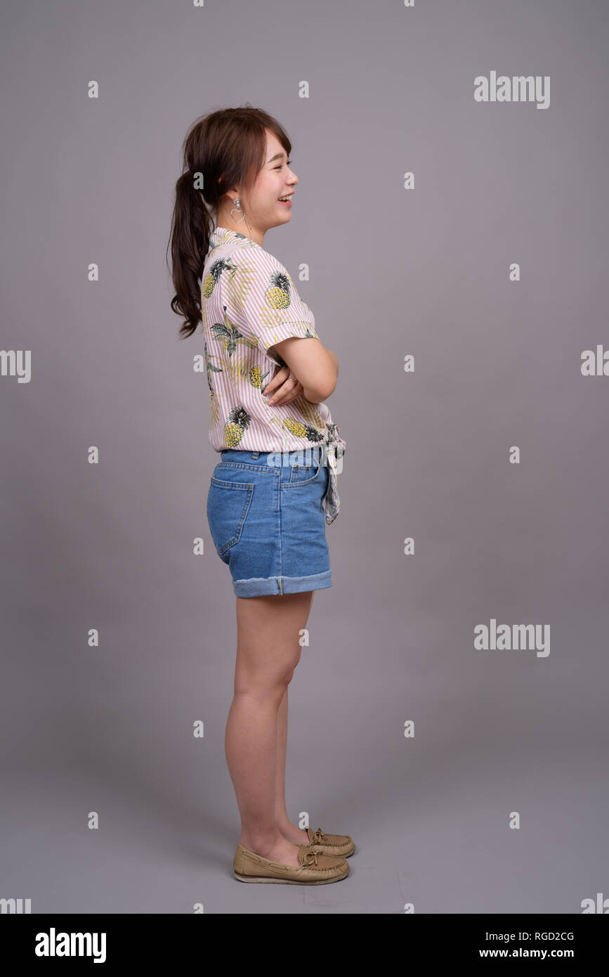 Full length portrait of beautiful young Asian woman standing Stock ...