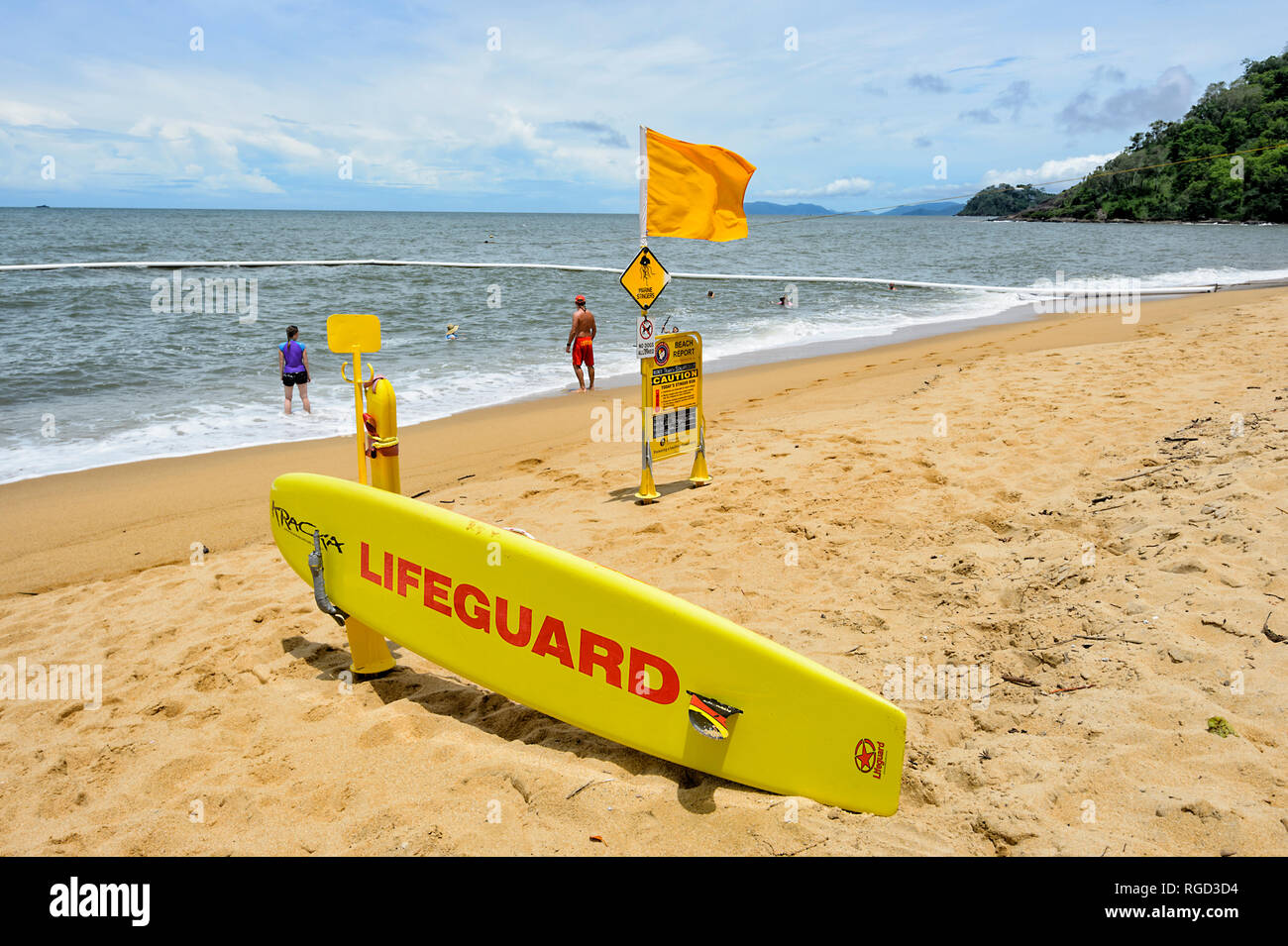 Safe swimming area with lifeguard's surfboard and yellow flag at ...