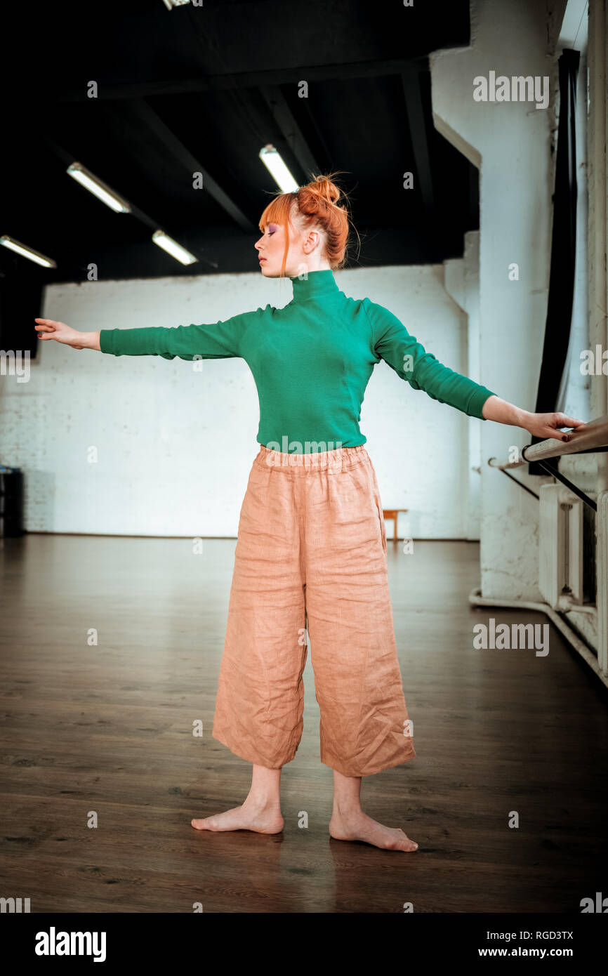 Young professional modern dancer with red hair looking graceful Stock ...