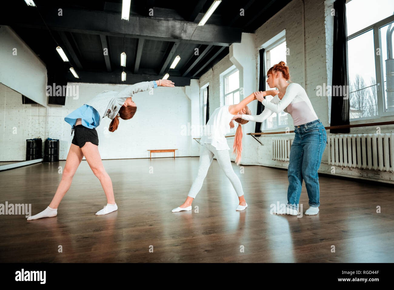 Two pretty teenagers having dance lesson in the ballet school Stock ...