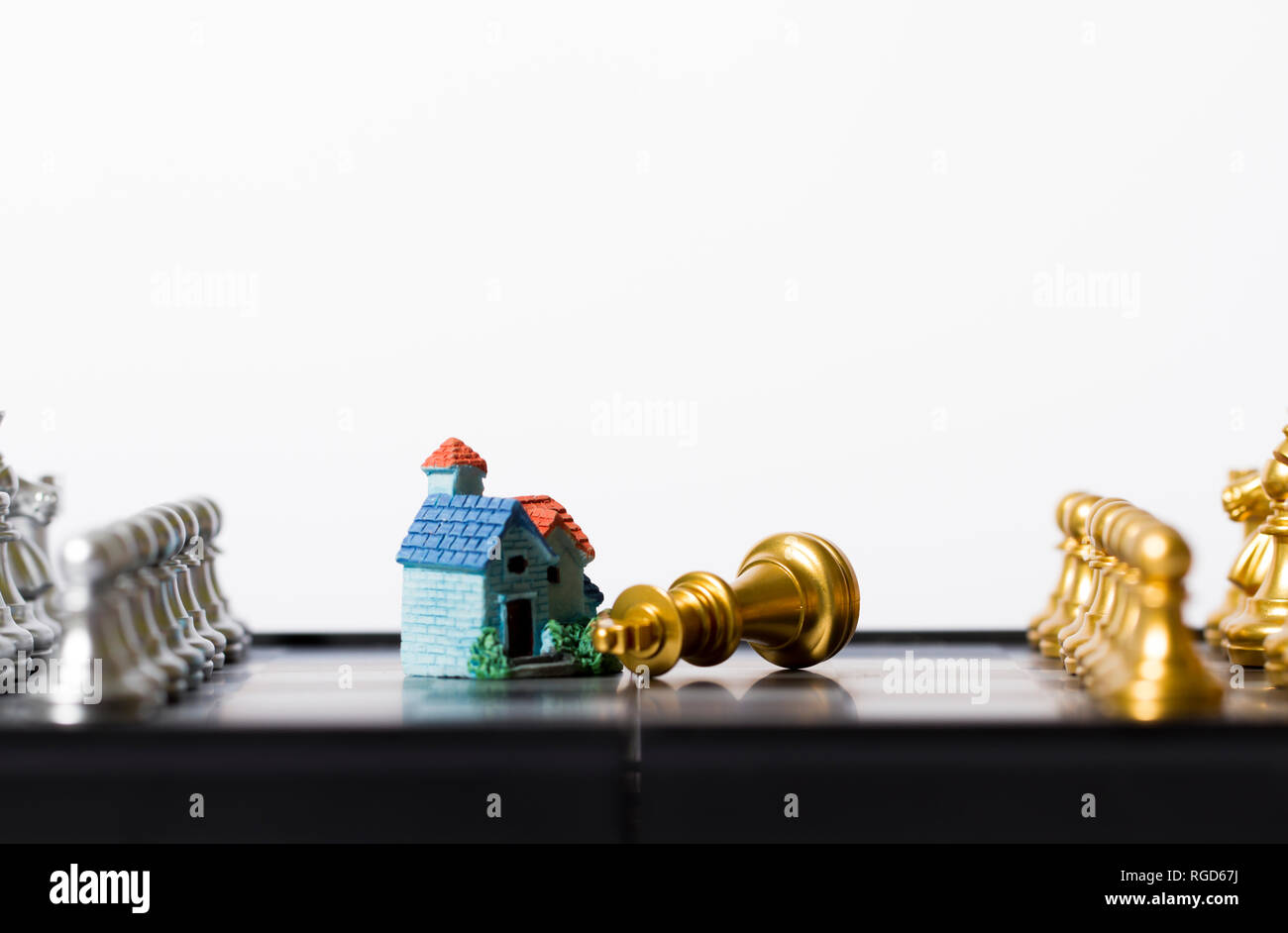 Chess and small house Stock Photo - Alamy