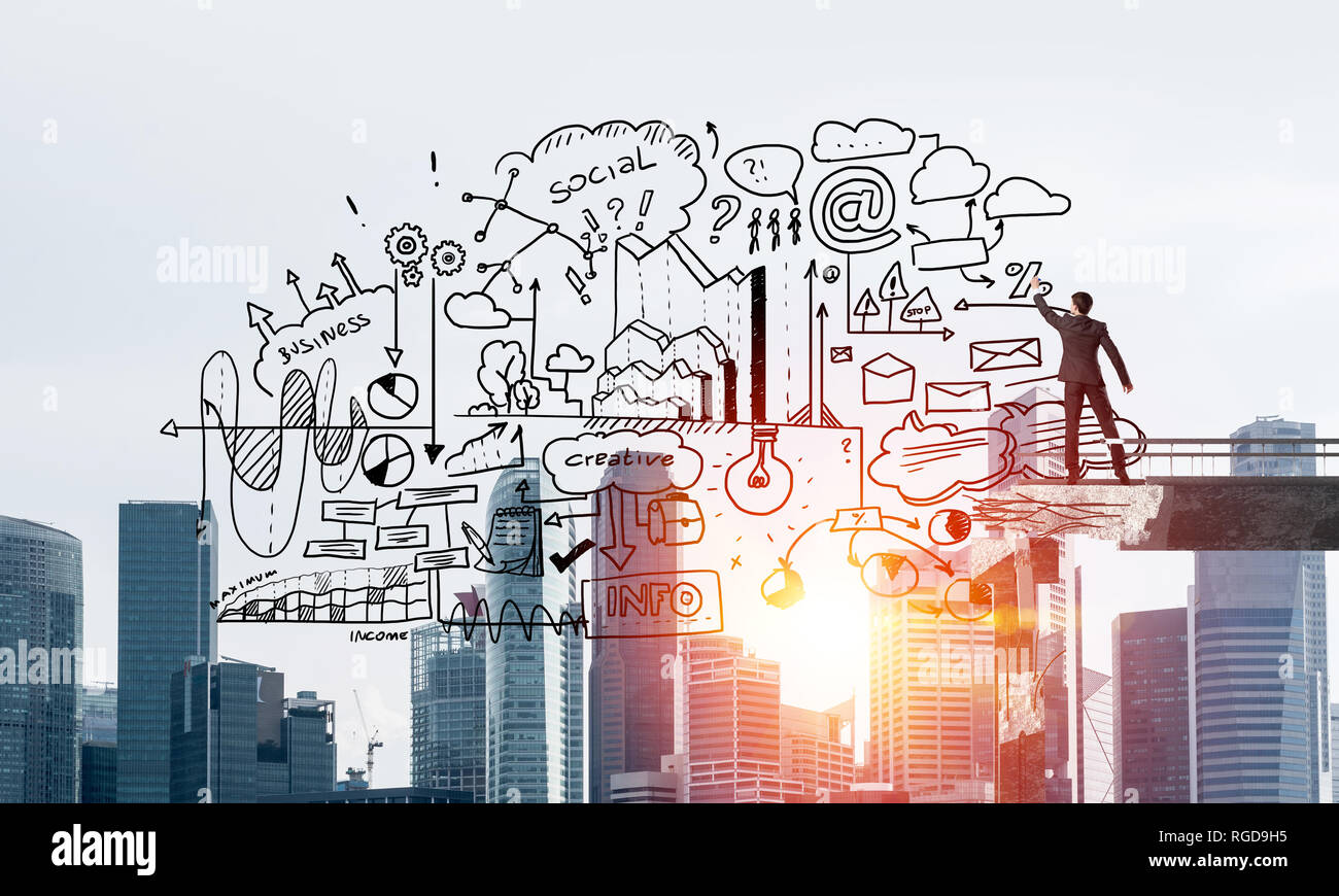 Businessman drawing business conceptual sketches Stock Photo - Alamy