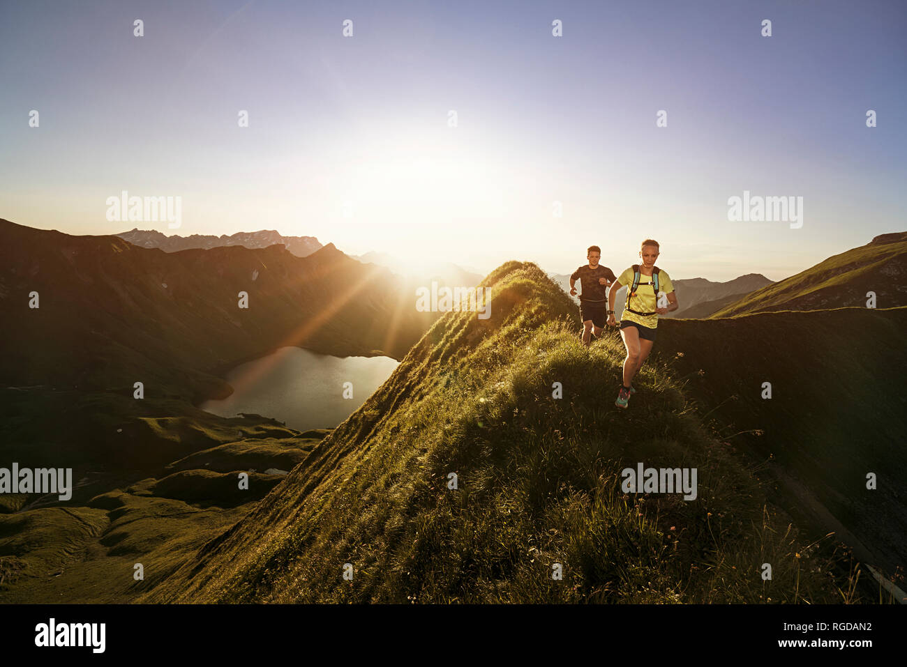 Man woman running mountain ridge hi-res stock photography and images ...