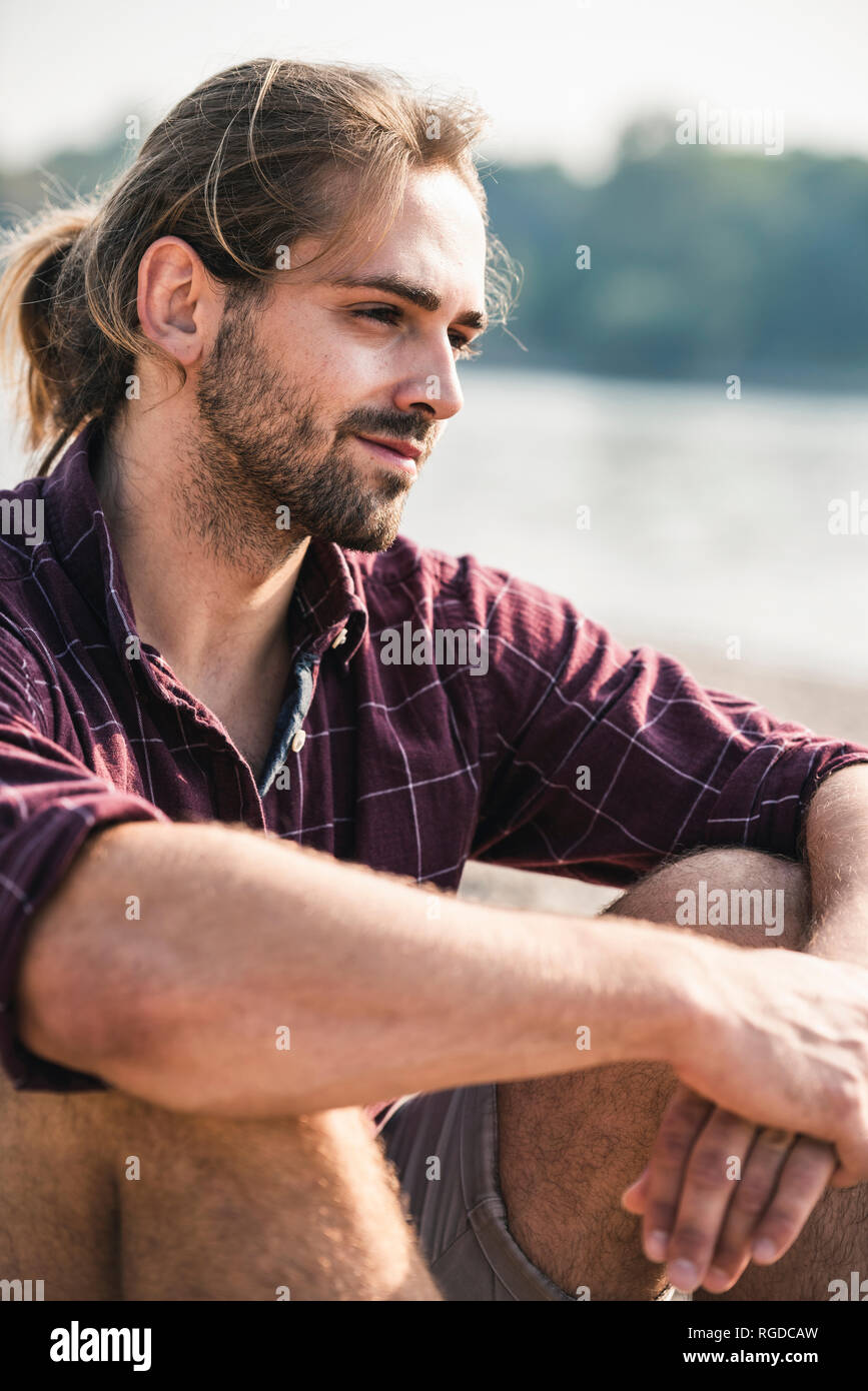 Man sitting by the riverside hi-res stock photography and images - Alamy