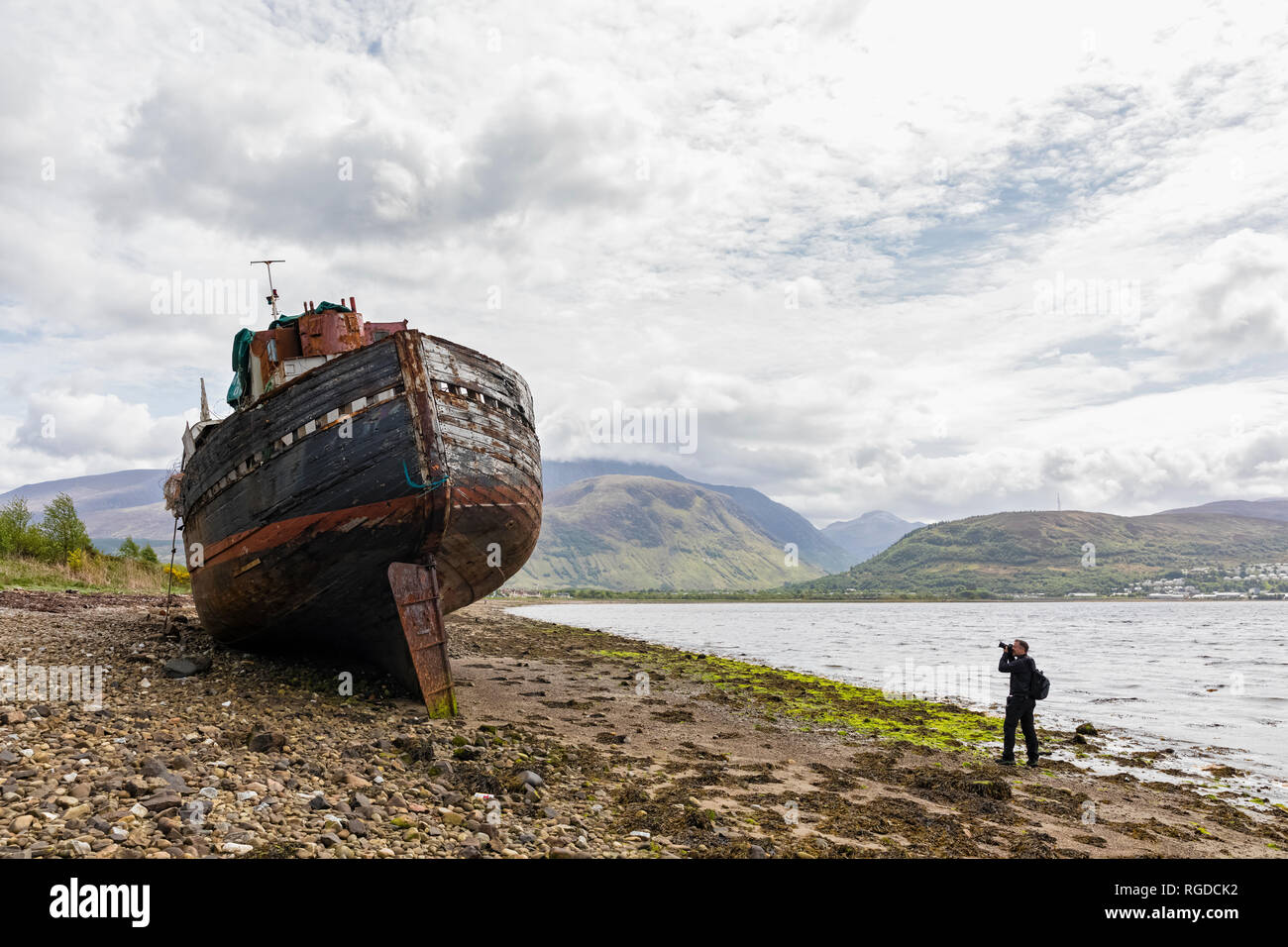 UK, Scotland, Highland, photographer taking picture of ship wreck at ...