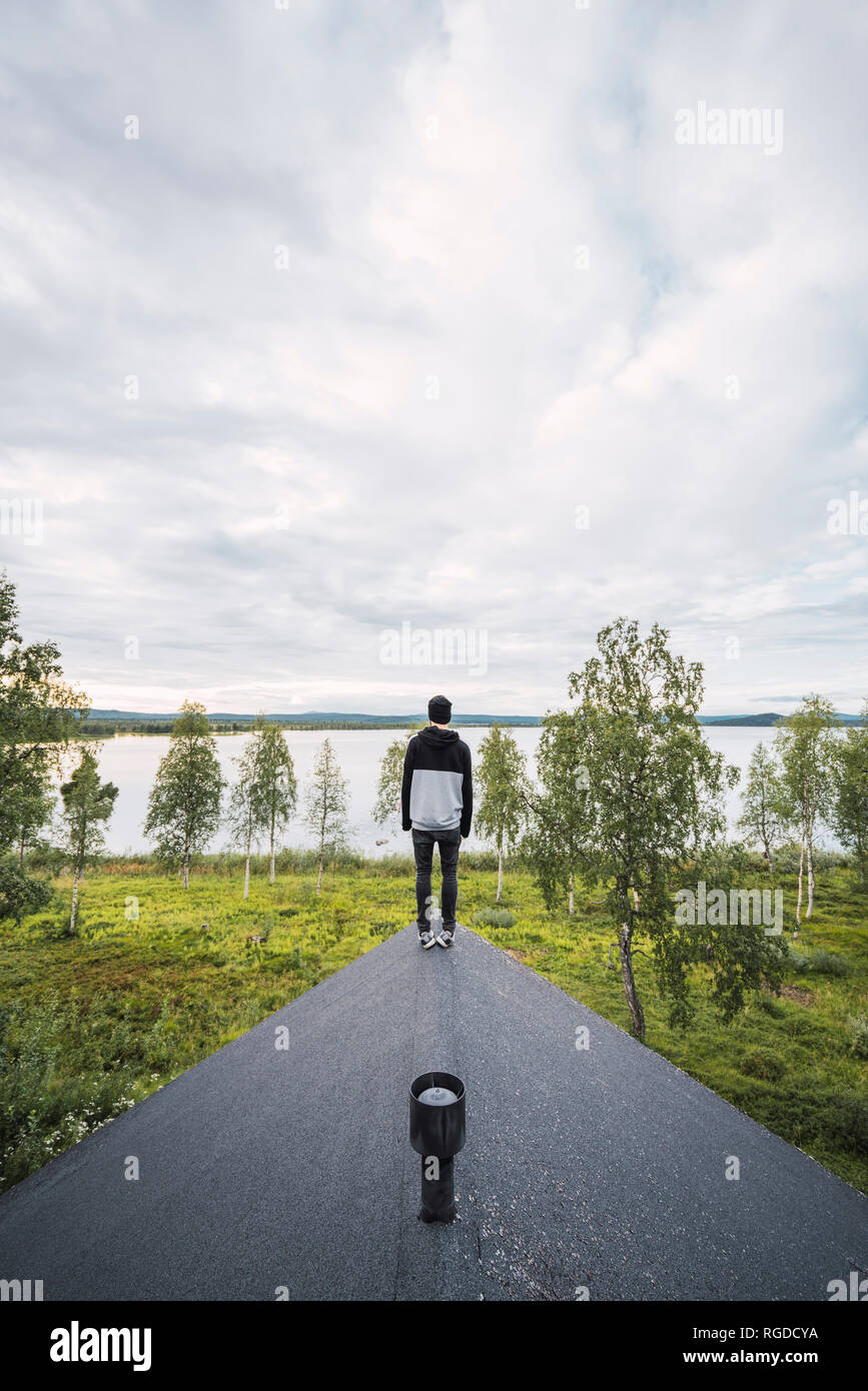 Man standing roof house lake hi-res stock photography and images - Alamy