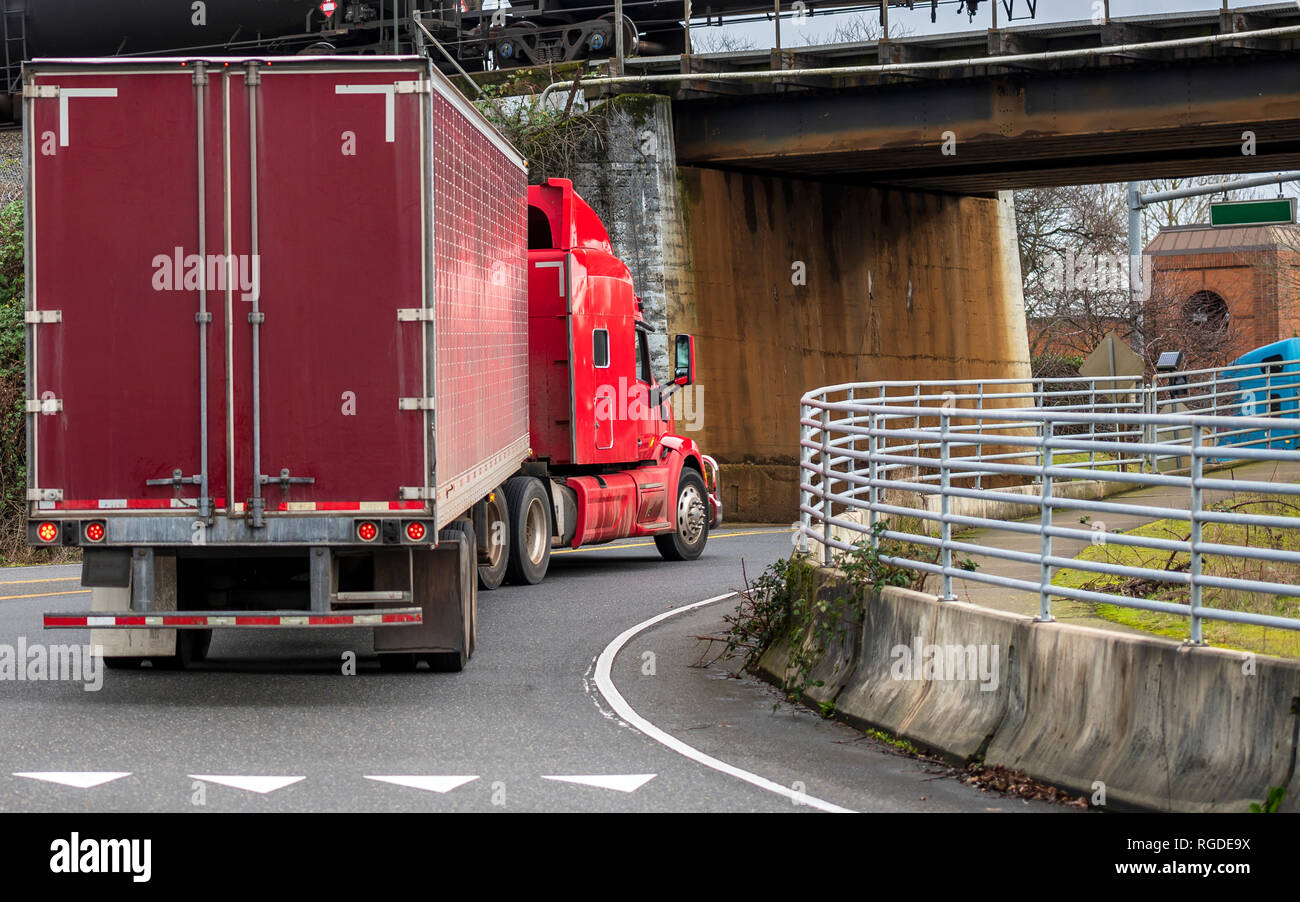 Big rig bright red classic American modern semi truck with high cab for ...