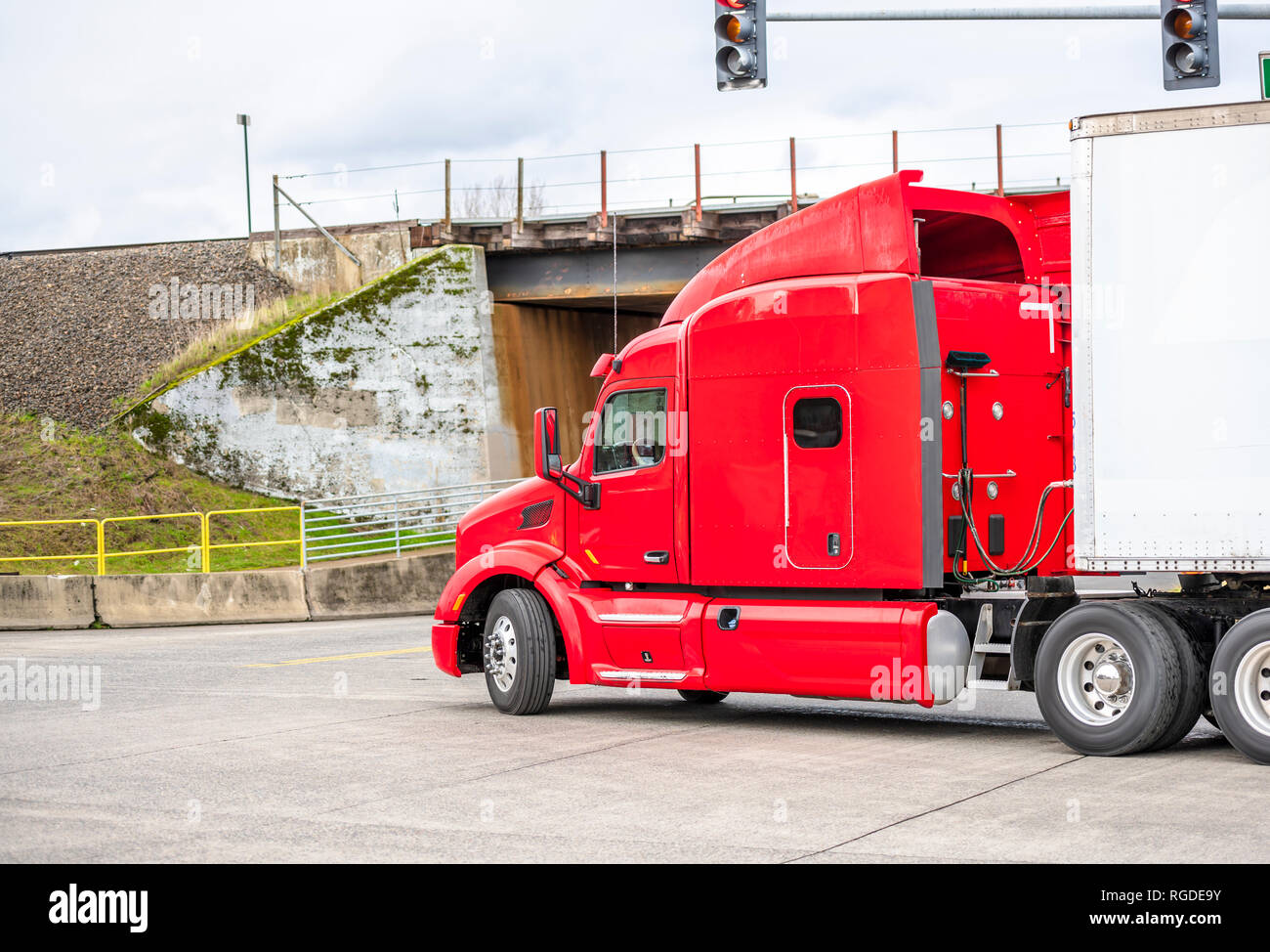 Big rig bright red classic American modern semi truck with high cab for ...