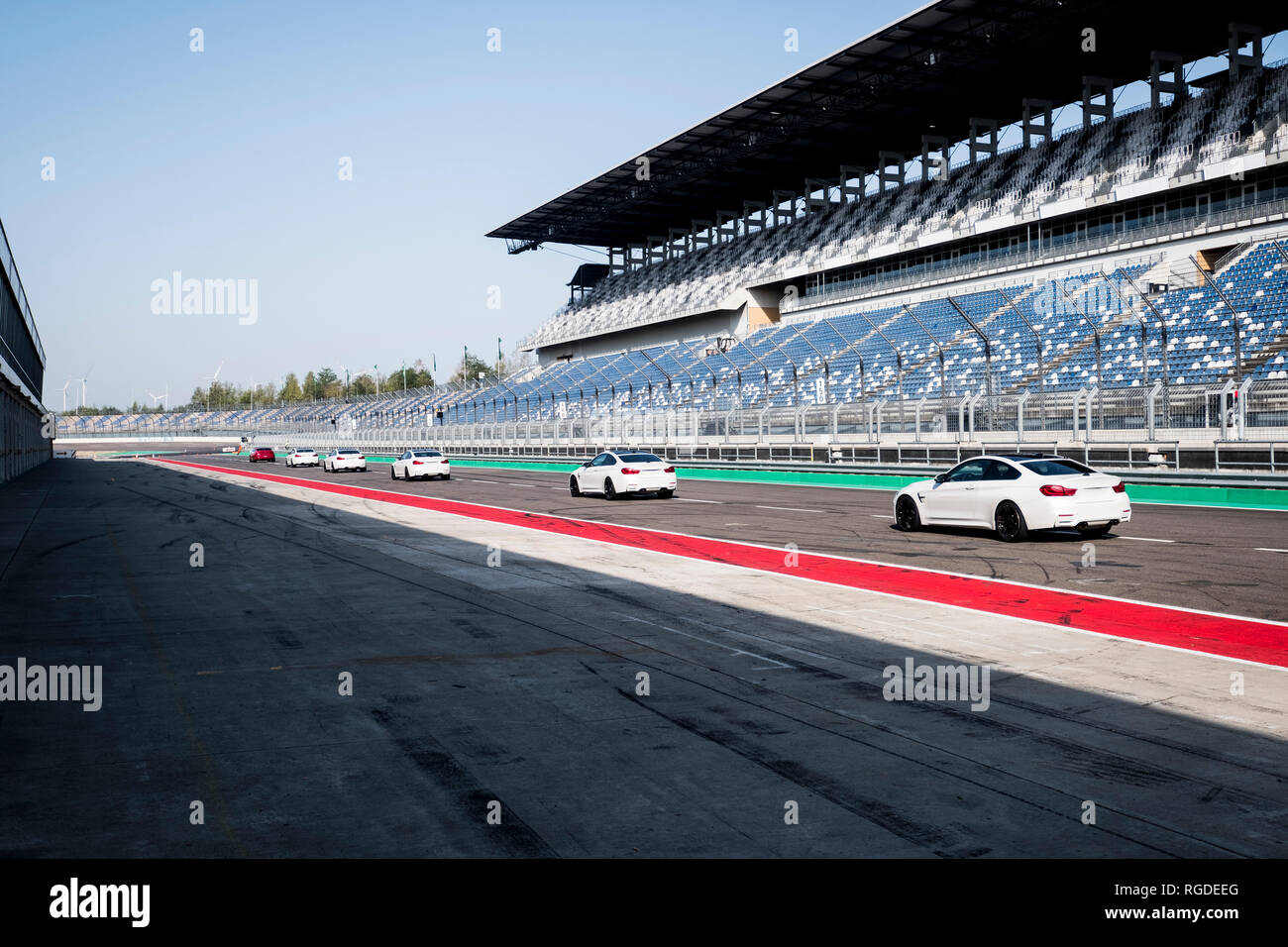 Row cars driving on road hi-res stock photography and images - Alamy