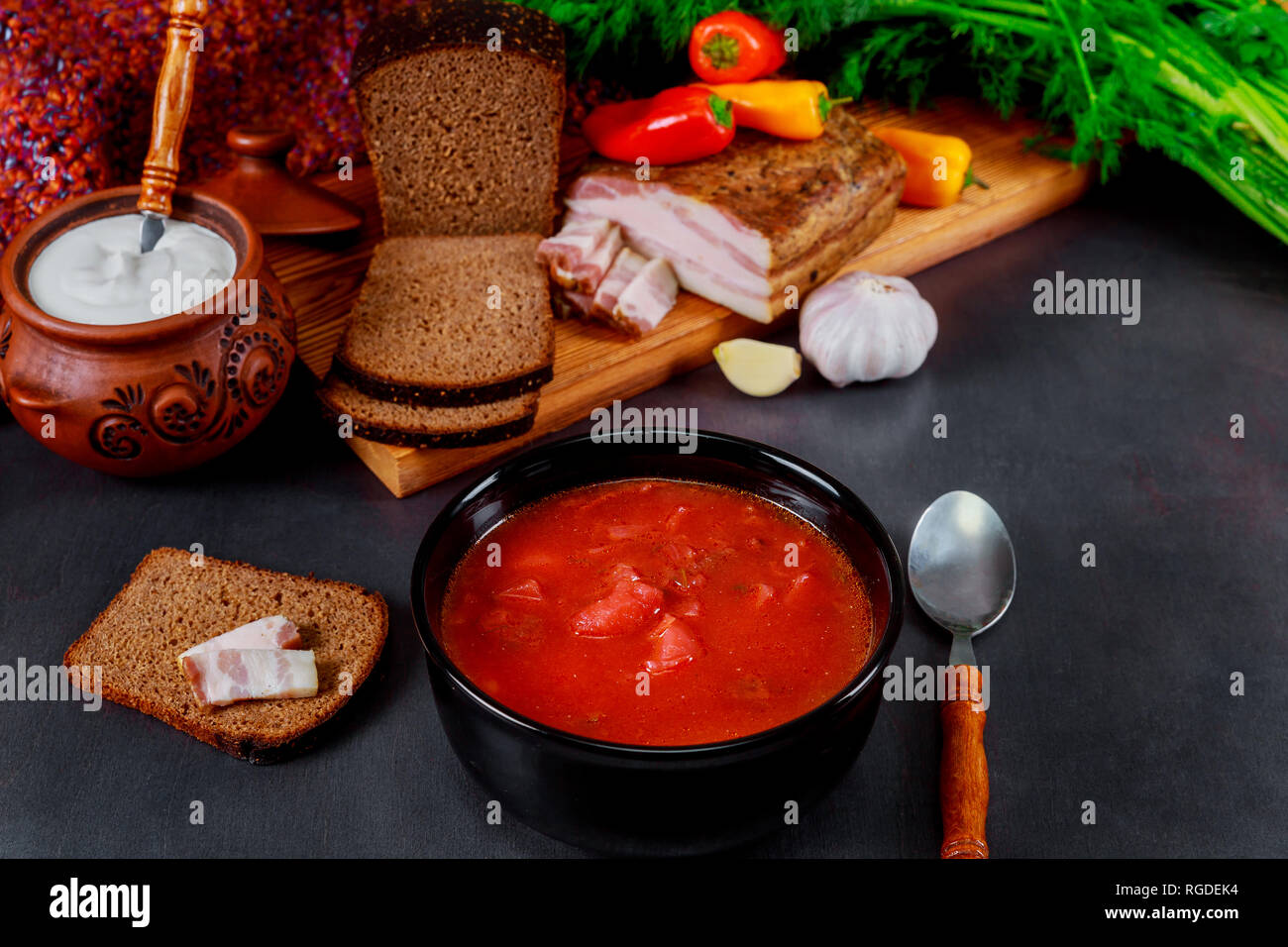Ukrainian borsch of national kitchen in ceramic bowl with garlic with ...