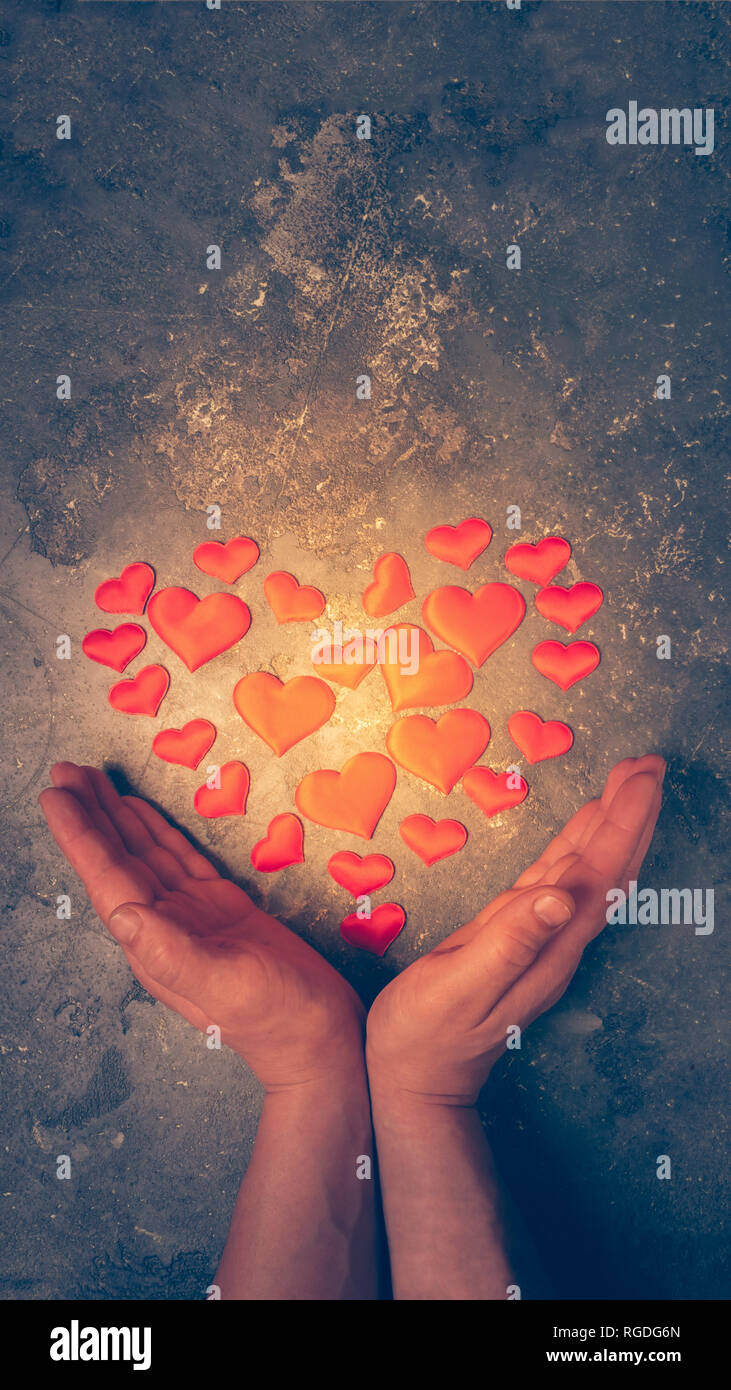 The symbol of love and health is the heart in male hands. The burning ...