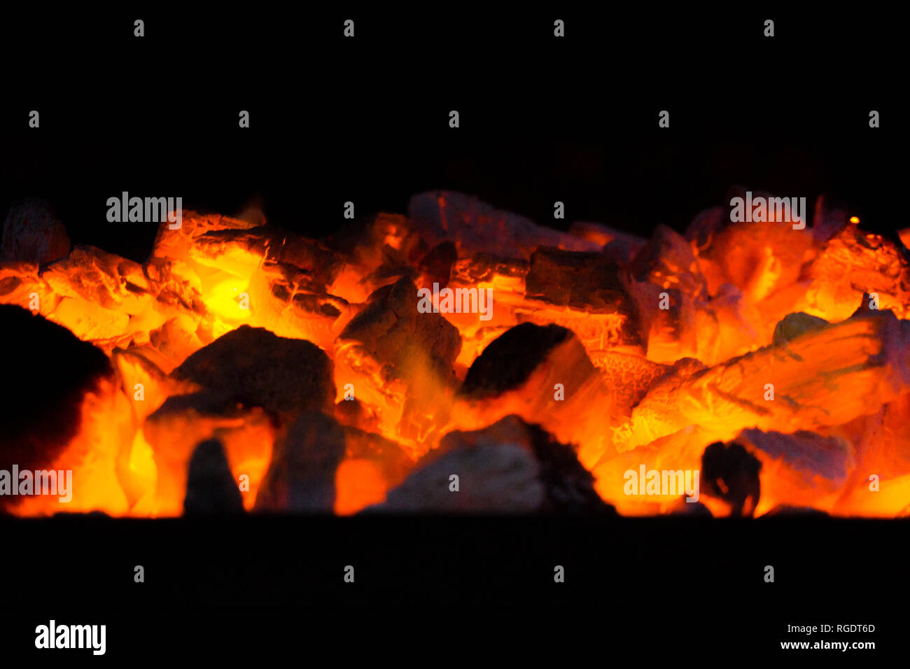 Glowing embers in hot red color. Embers closeup. Embers after a fire ...