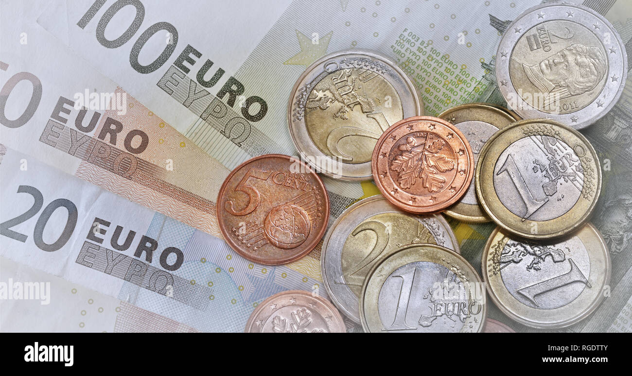 Euro coins and Euro bills as Banner Stock Photo - Alamy