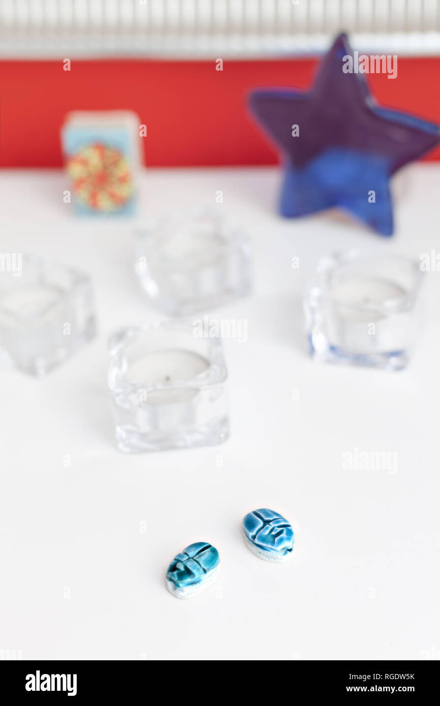 Modern Egyptian blue scarabs souvenir as a decoration with glass candle ...