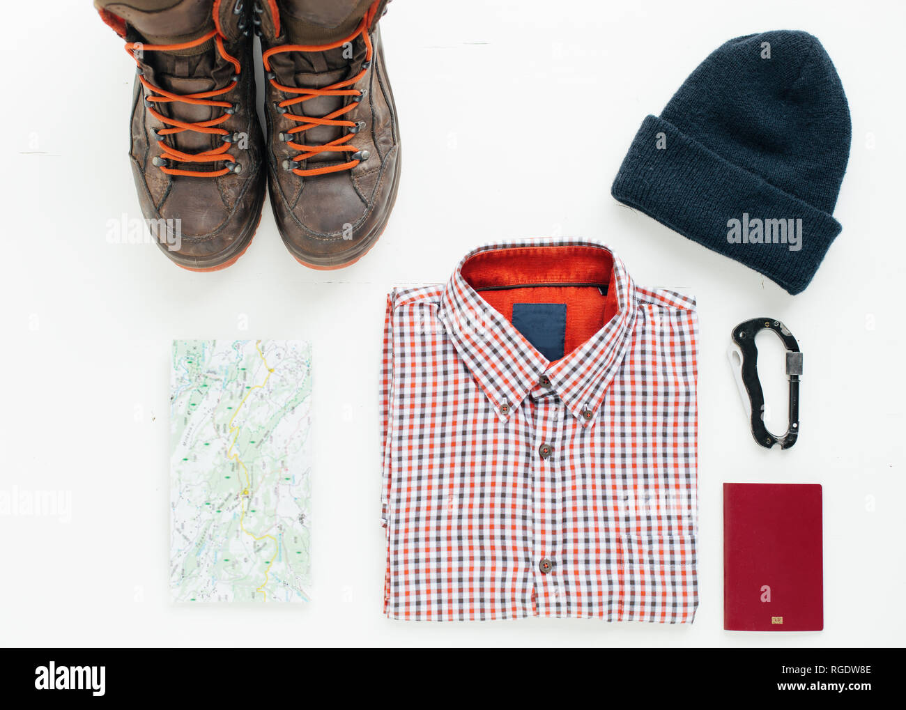 Hiking boots, plaid shirt, wool cap and carabiner Stock Photo - Alamy