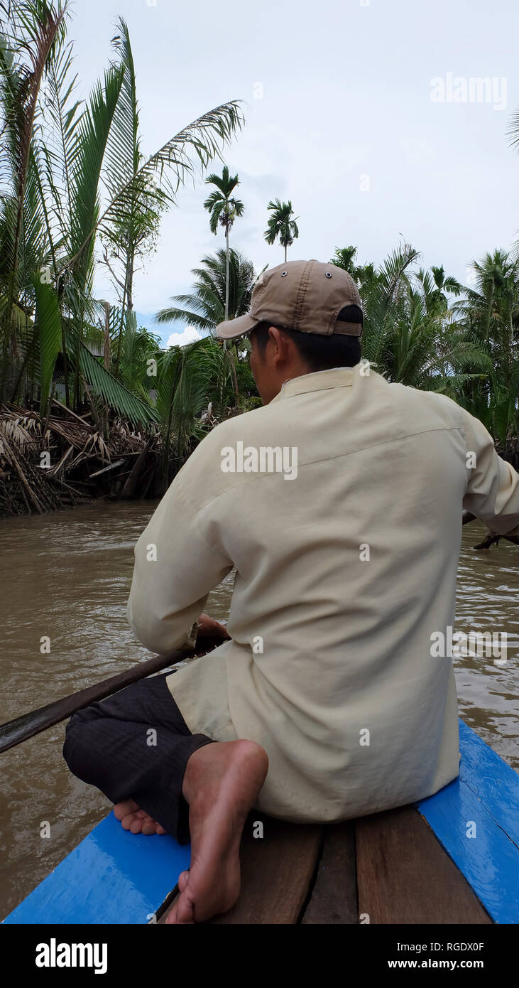 Vietnam man boat forest hi-res stock photography and images - Alamy