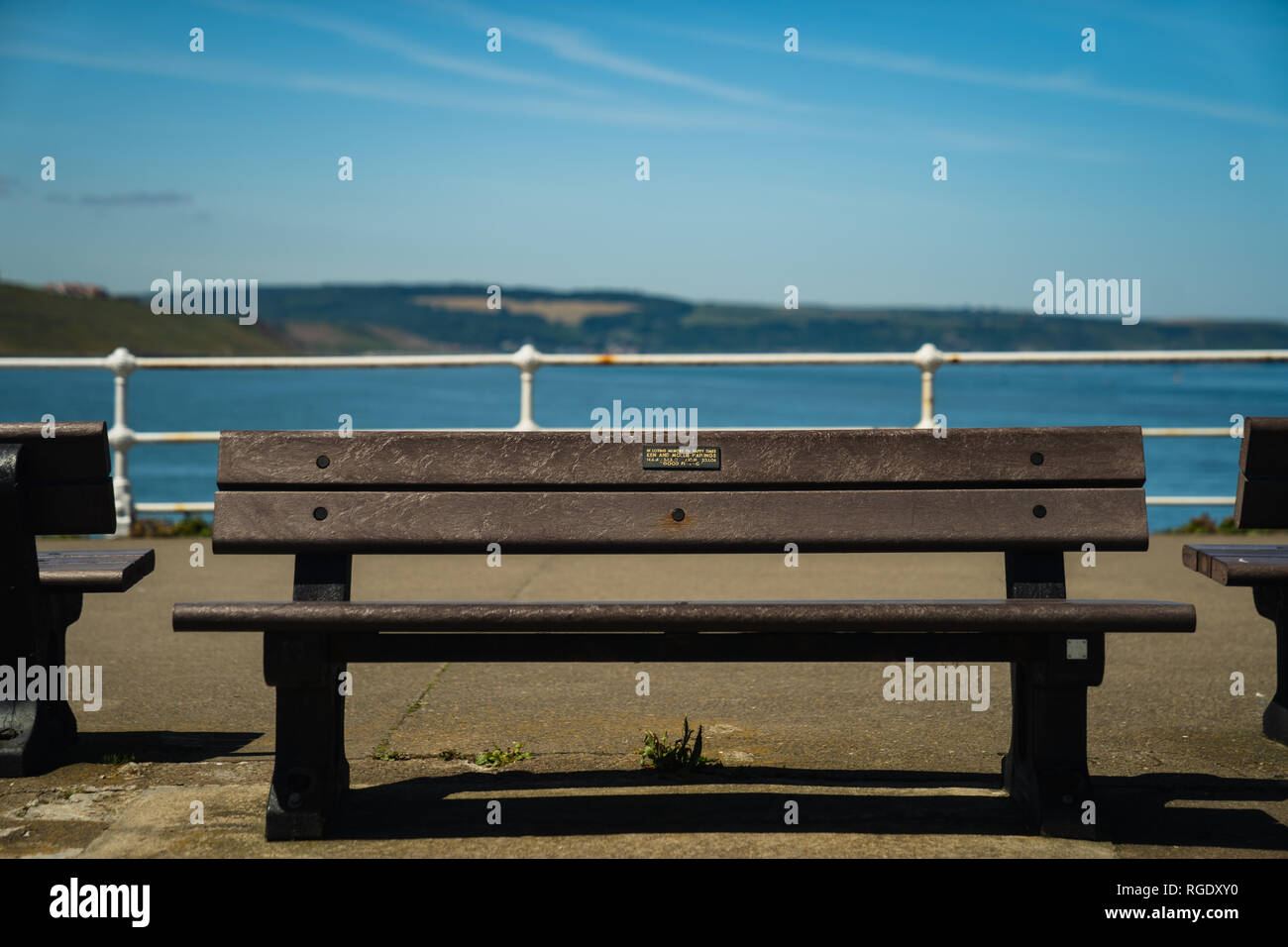 Isolated Wooden Bench at the Seaside Stock Photo - Alamy
