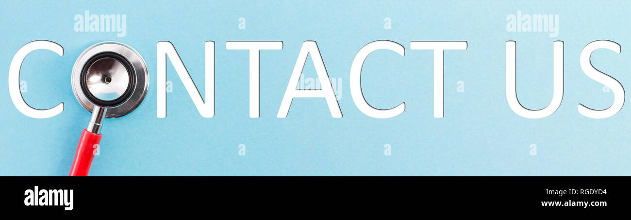 Contact us text with stethoscope as letter on blue background as call ...