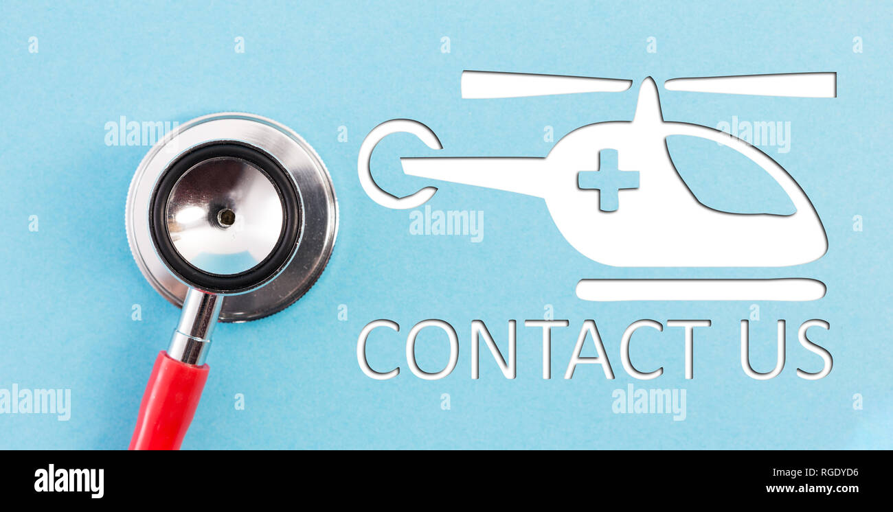 Contact us text with ambulance helicopter as emergency concept on blue ...