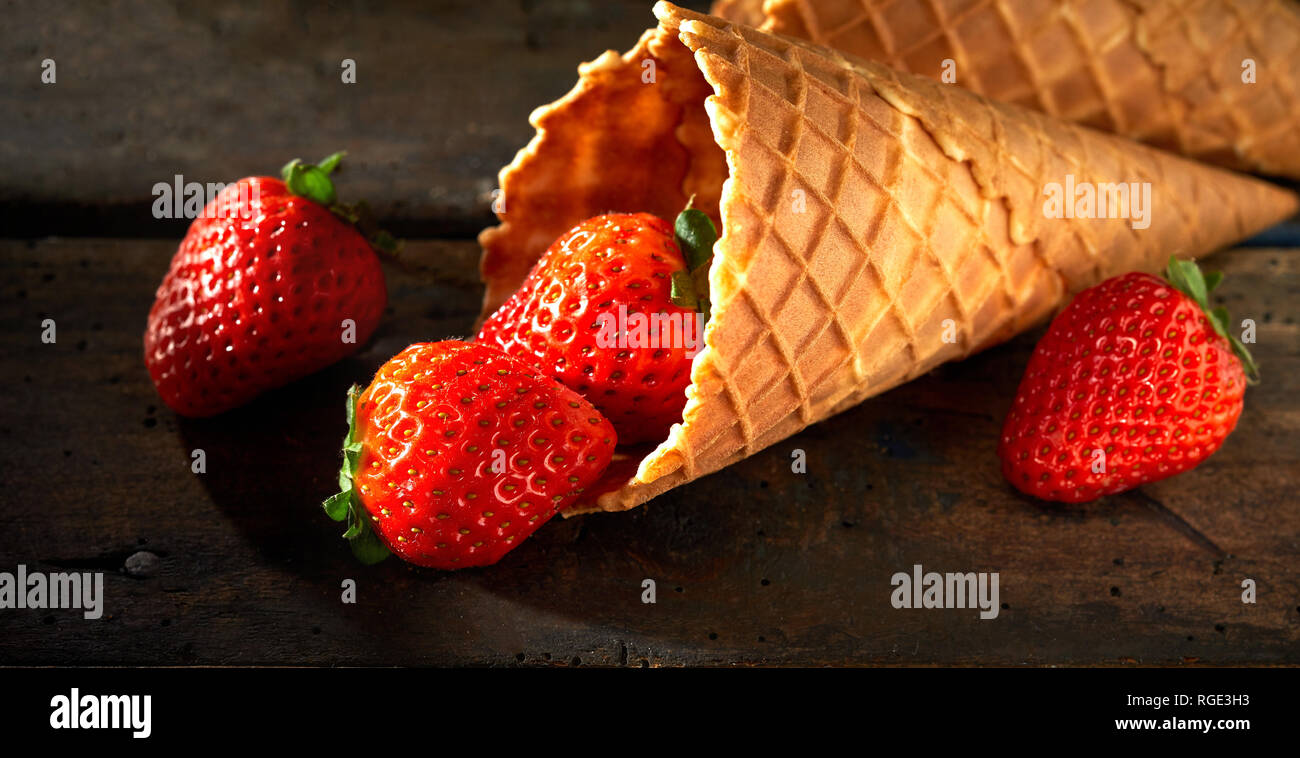 Tasty fresh ripe red strawberries in a cornet or waffle ice cream cone ...