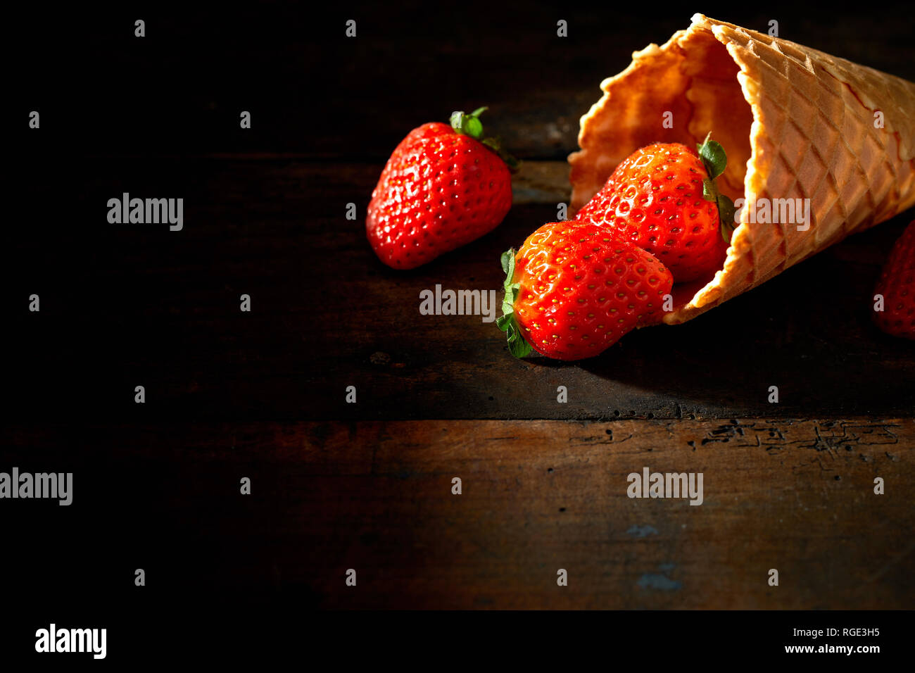 Fresh summer strawberries in an ice cream cone or cornet arranged in ...
