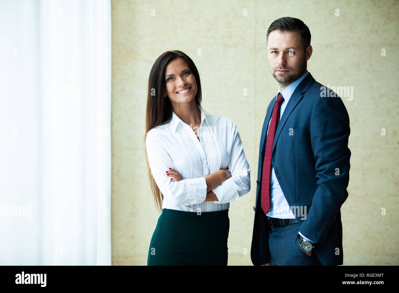 Professional male and female business partners having meeting to ...