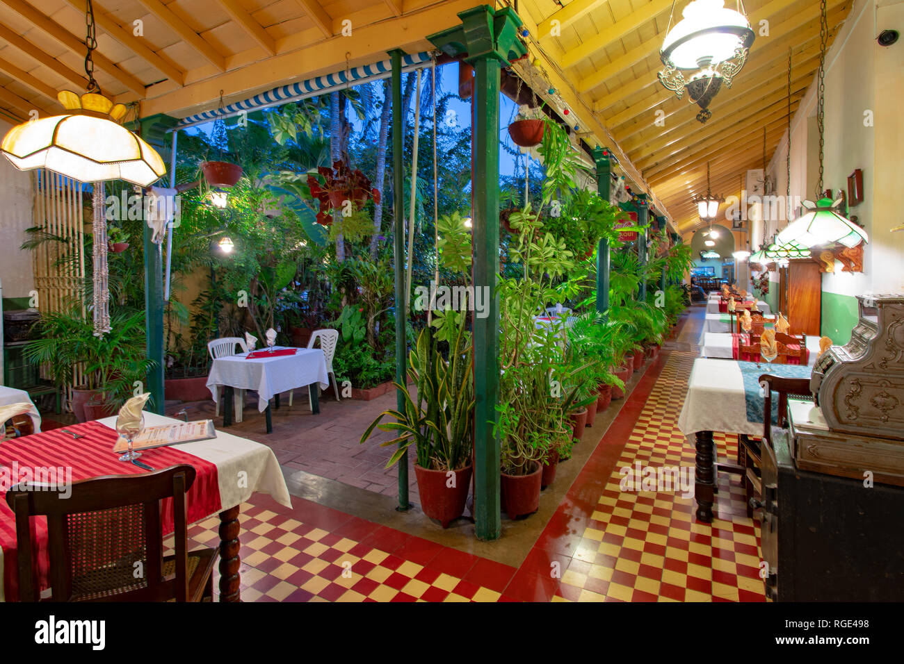 Patio and corridor of a colonial house with tables in the garden Stock ...