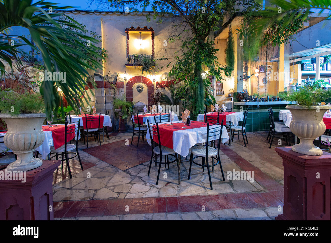 Patio and corridor of a colonial house with tables in the garden Stock ...