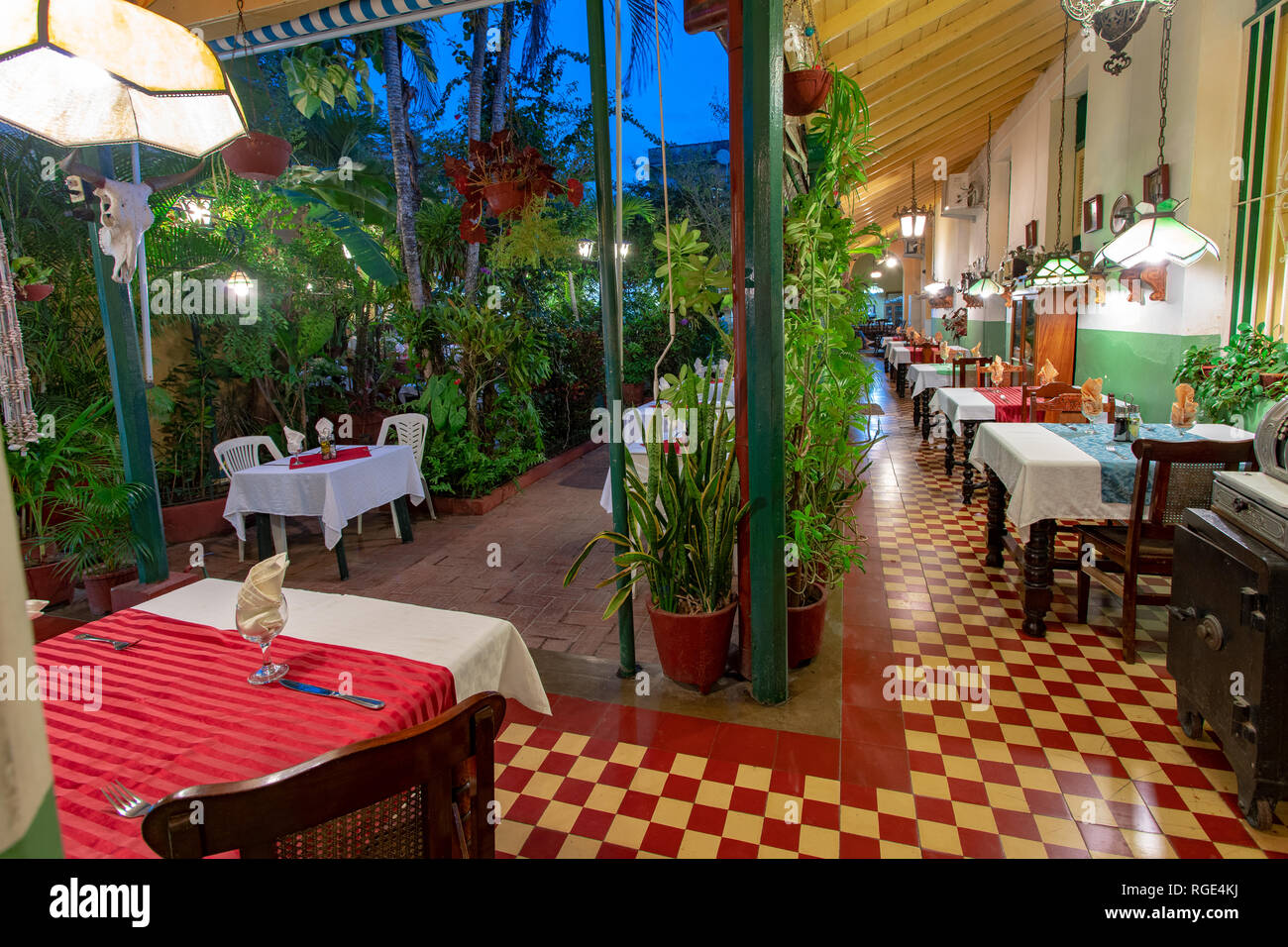 Patio and corridor of a colonial house with tables in the garden Stock ...