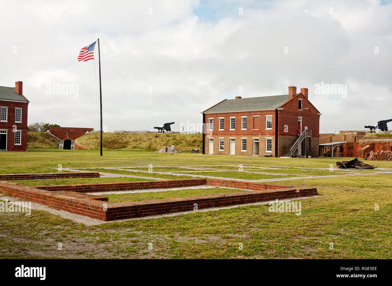 fort inside masonry walls, parade, red brick buildings, flag flying ...