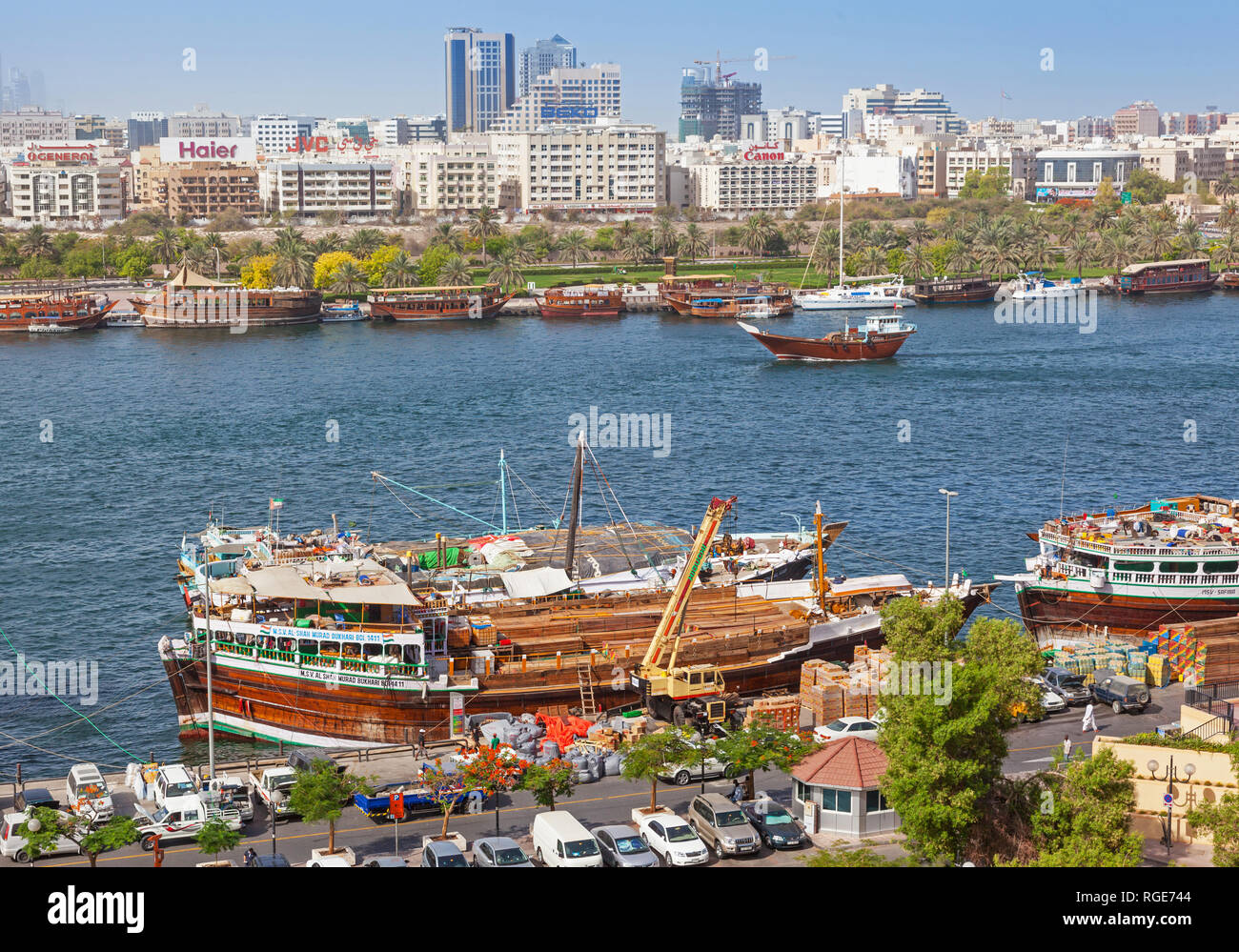 Traditional wooden trading dhows being loaded in Dubai Creek, Dubai ...