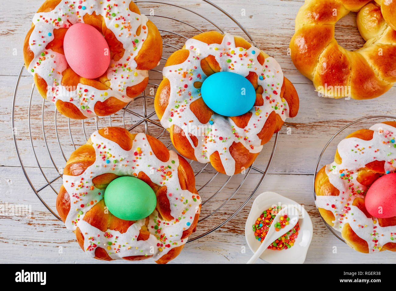 homemade sweet Italian Easter Bread Rings glazed around dyed egg and ...