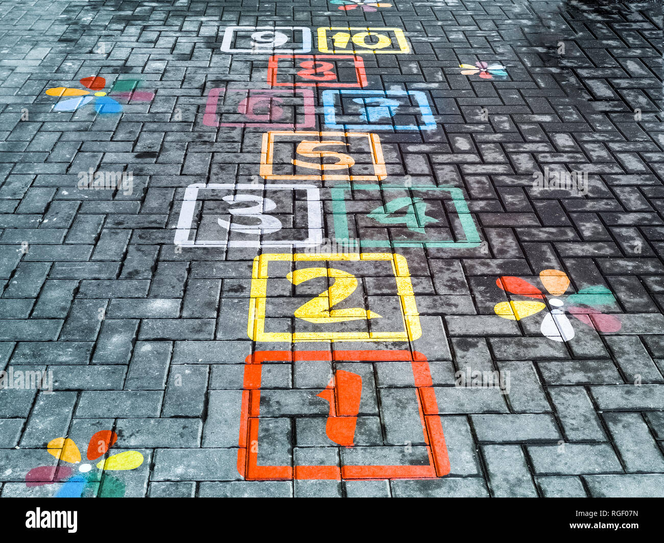 colorful hopscotch game drawn on to a pavement Stock Photo - Alamy
