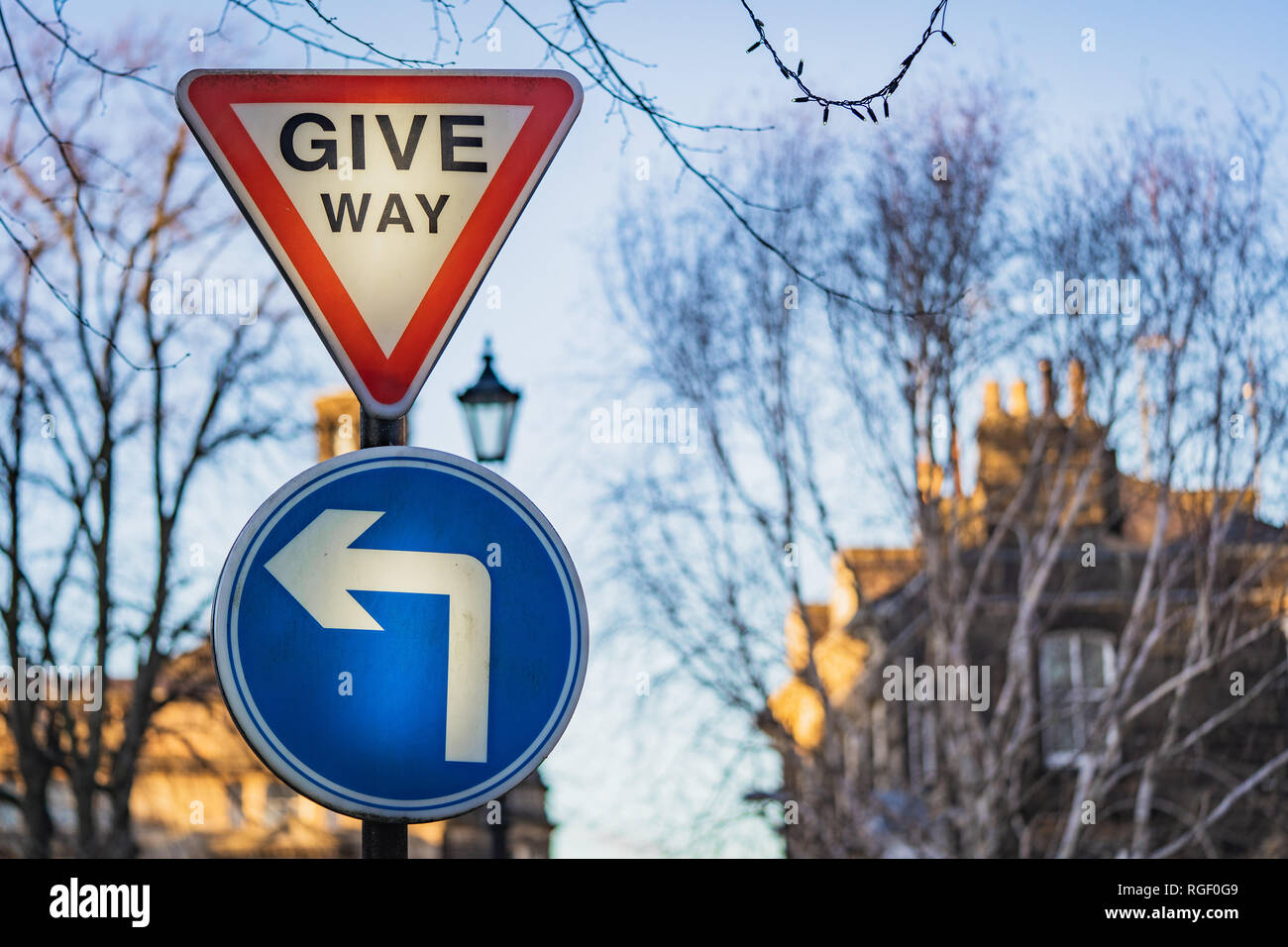 Give Way and Turn left Stock Photo - Alamy