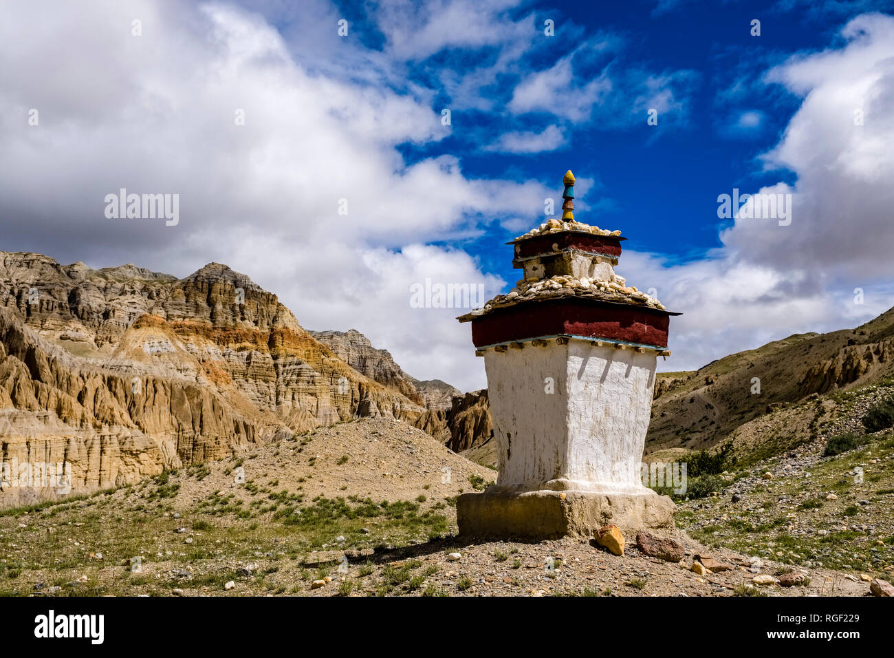 A chorten, stupa, is located at the entrance of the village Stock Photo ...