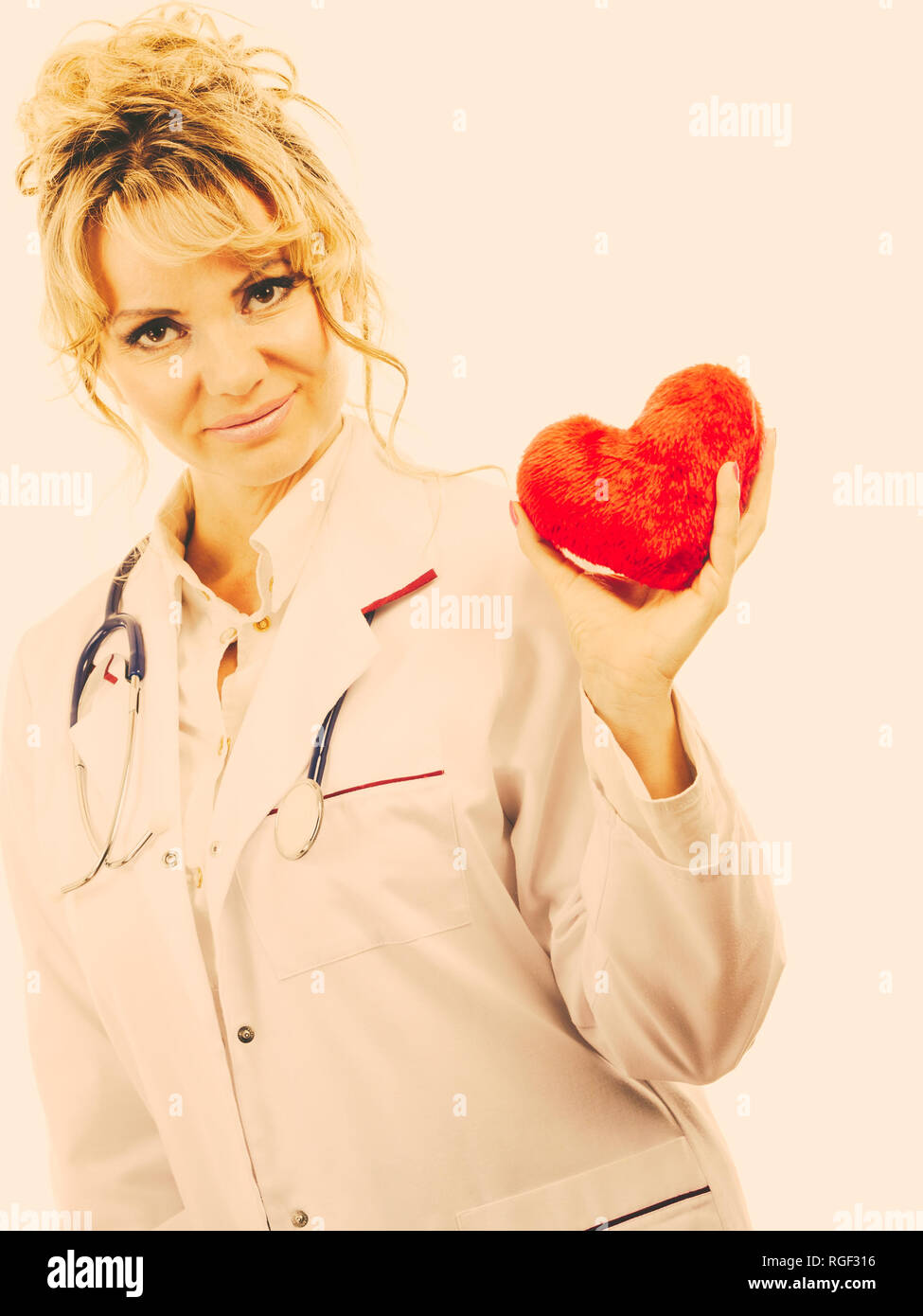 Periodic examinations. Cardiology concept. Female cardiologist holding ...