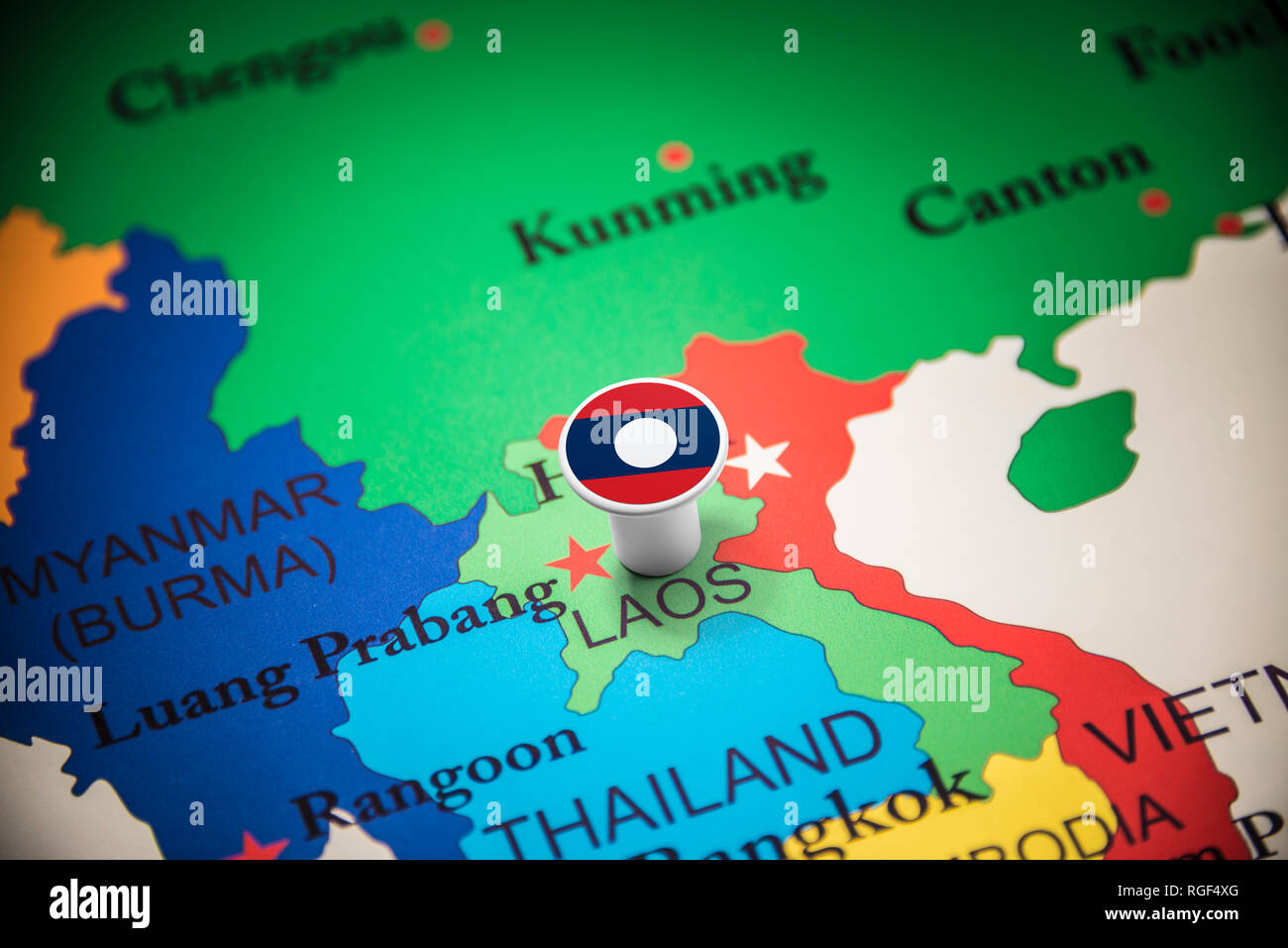 Laos marked with a flag on the map Stock Photo - Alamy