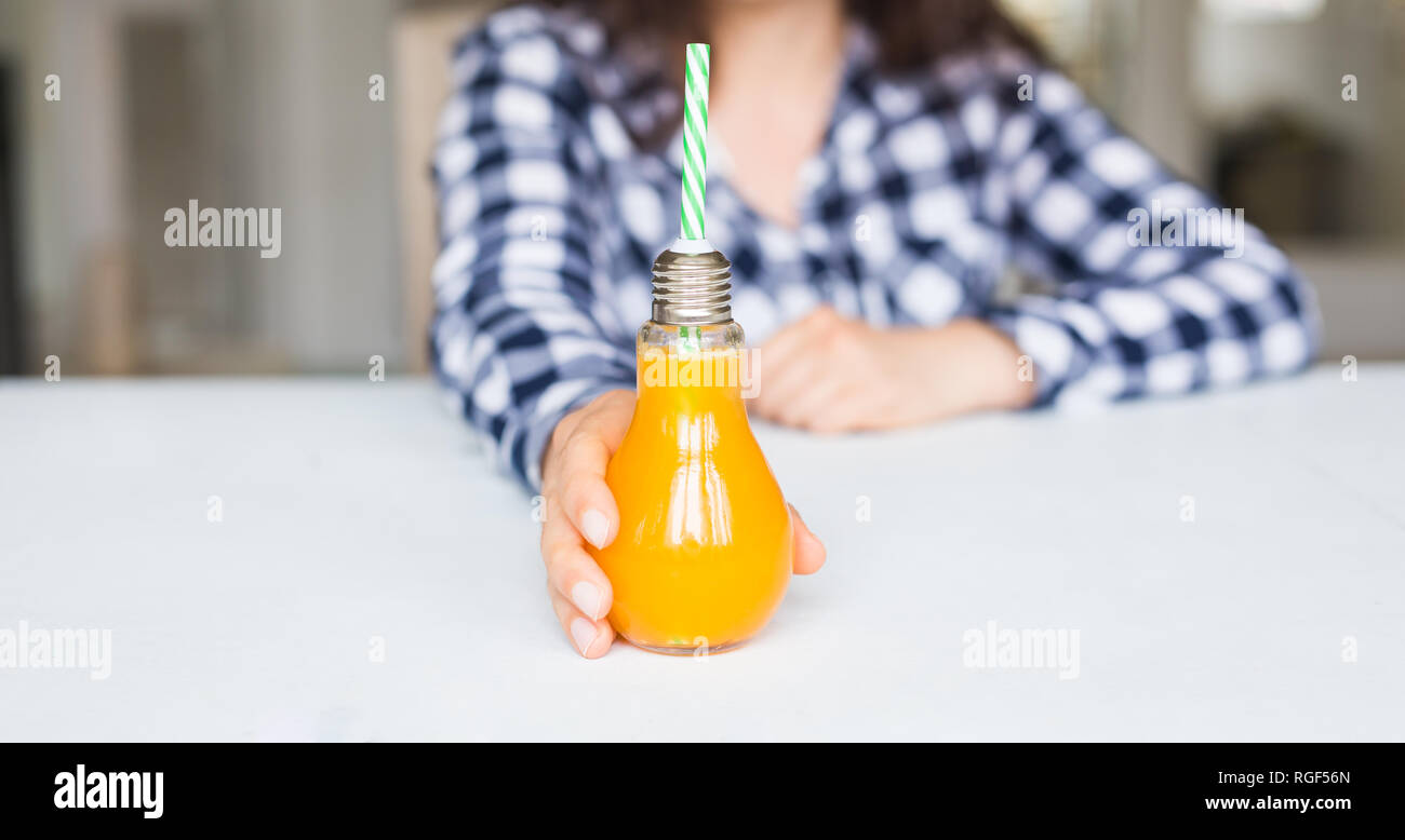 Drinks, diet and healthy lifestyle concept - woman giving you a bottle ...