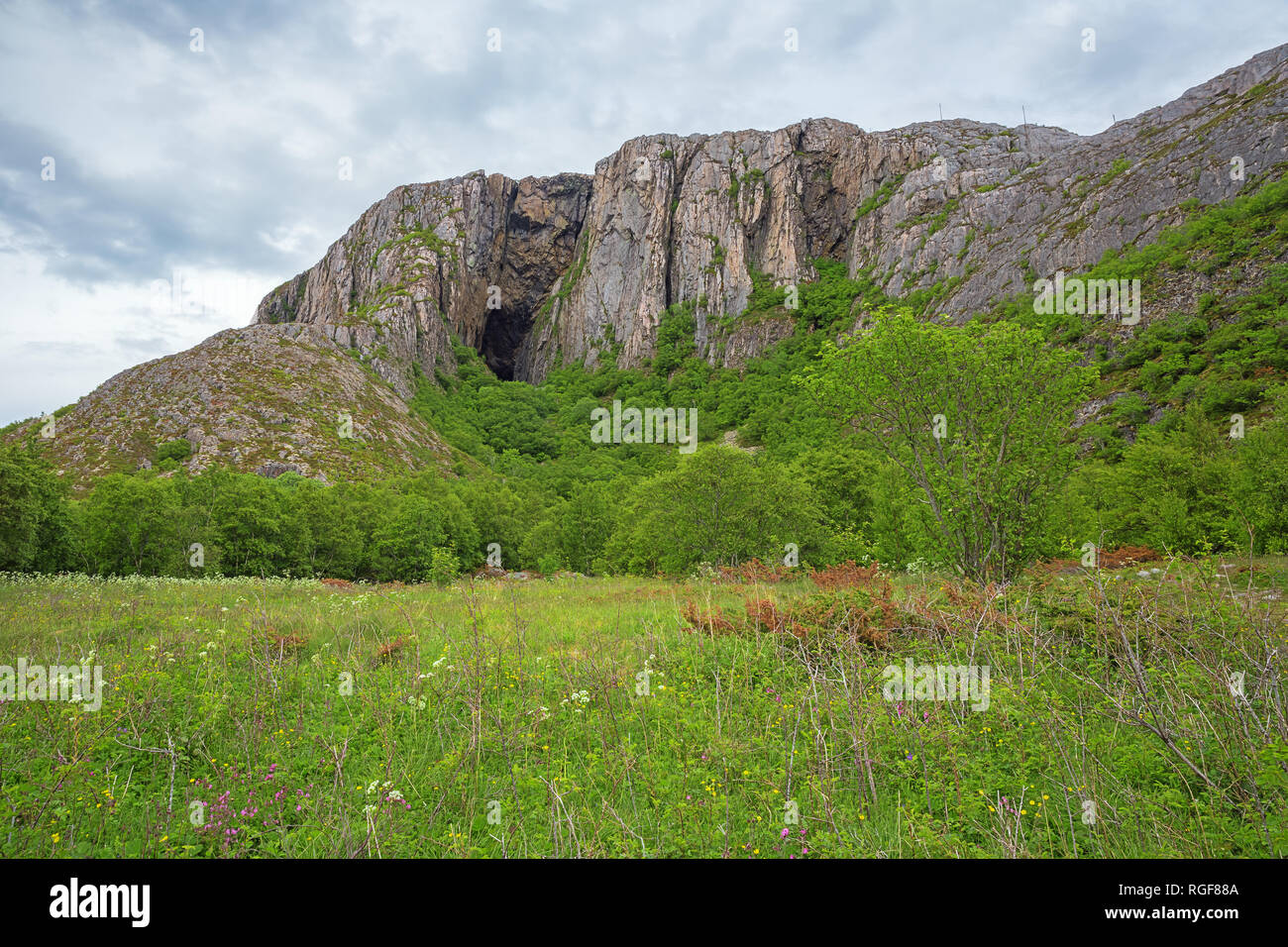 Torghatten seen from the west with the tunnel opening in the middle ...