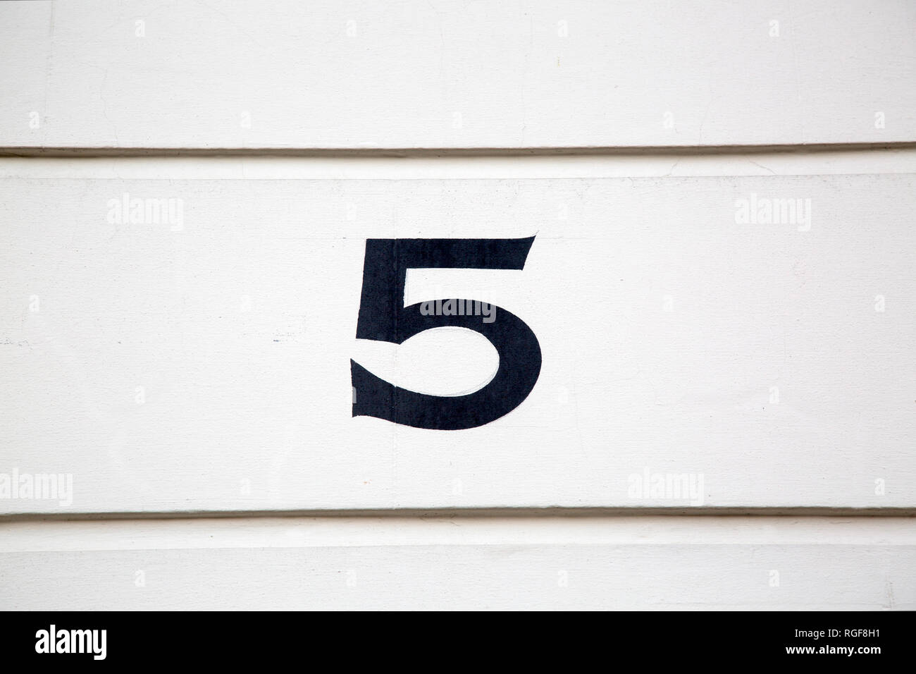 Number Five on Building Facade Stock Photo - Alamy