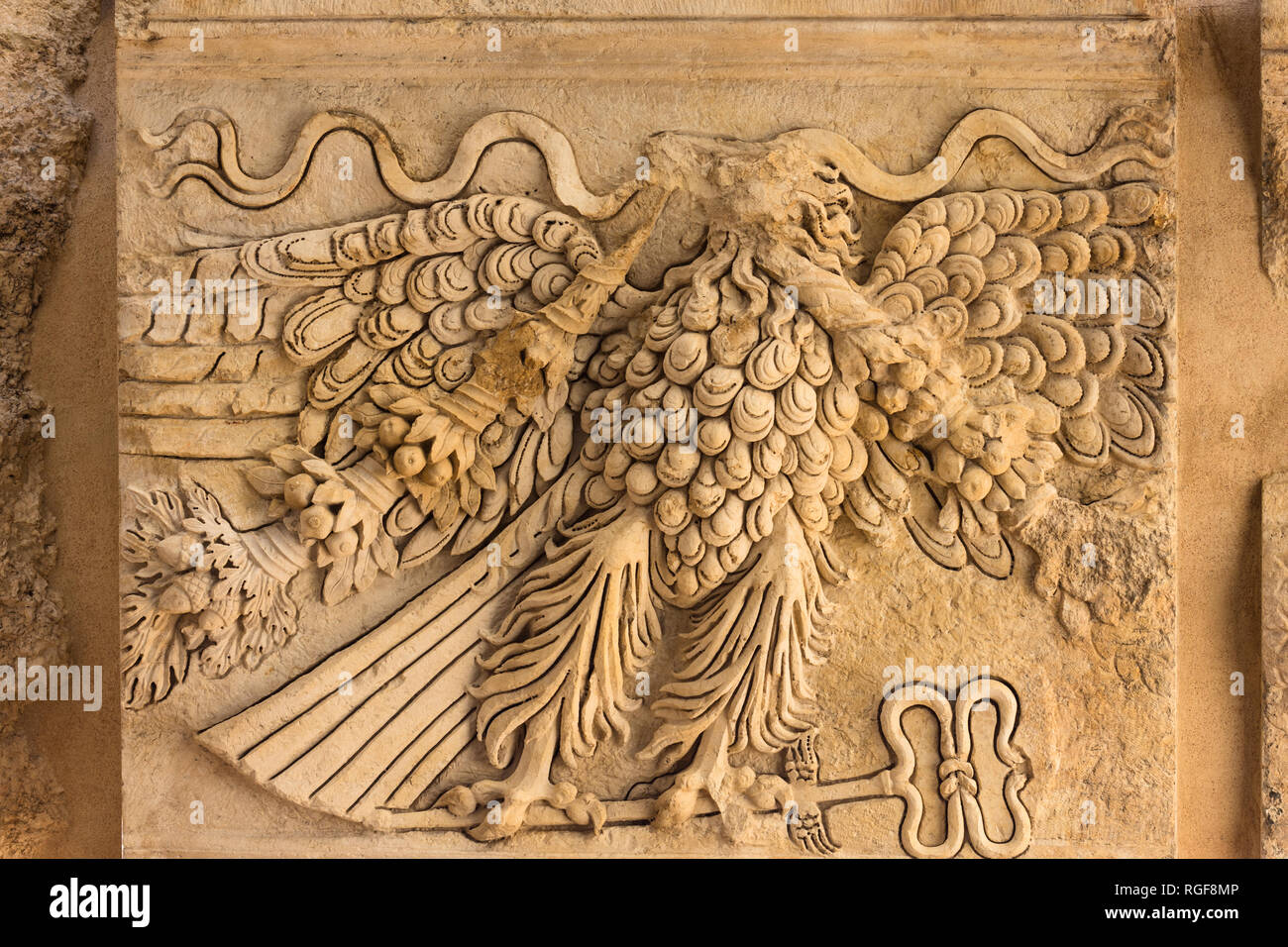 An eagle holding a herald's staff carved on the lintel's soffit at the ...