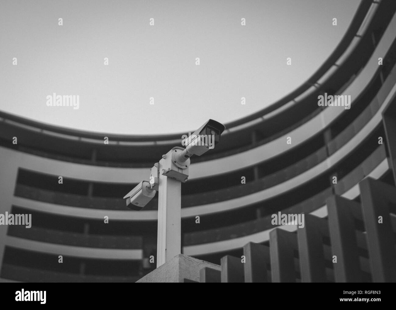 Security camera in public area. Black and white image of street ...