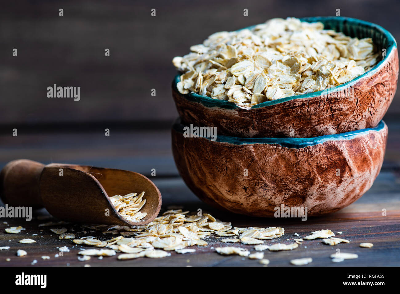 Healthy food concept with oats meal on dark rustic background with ...