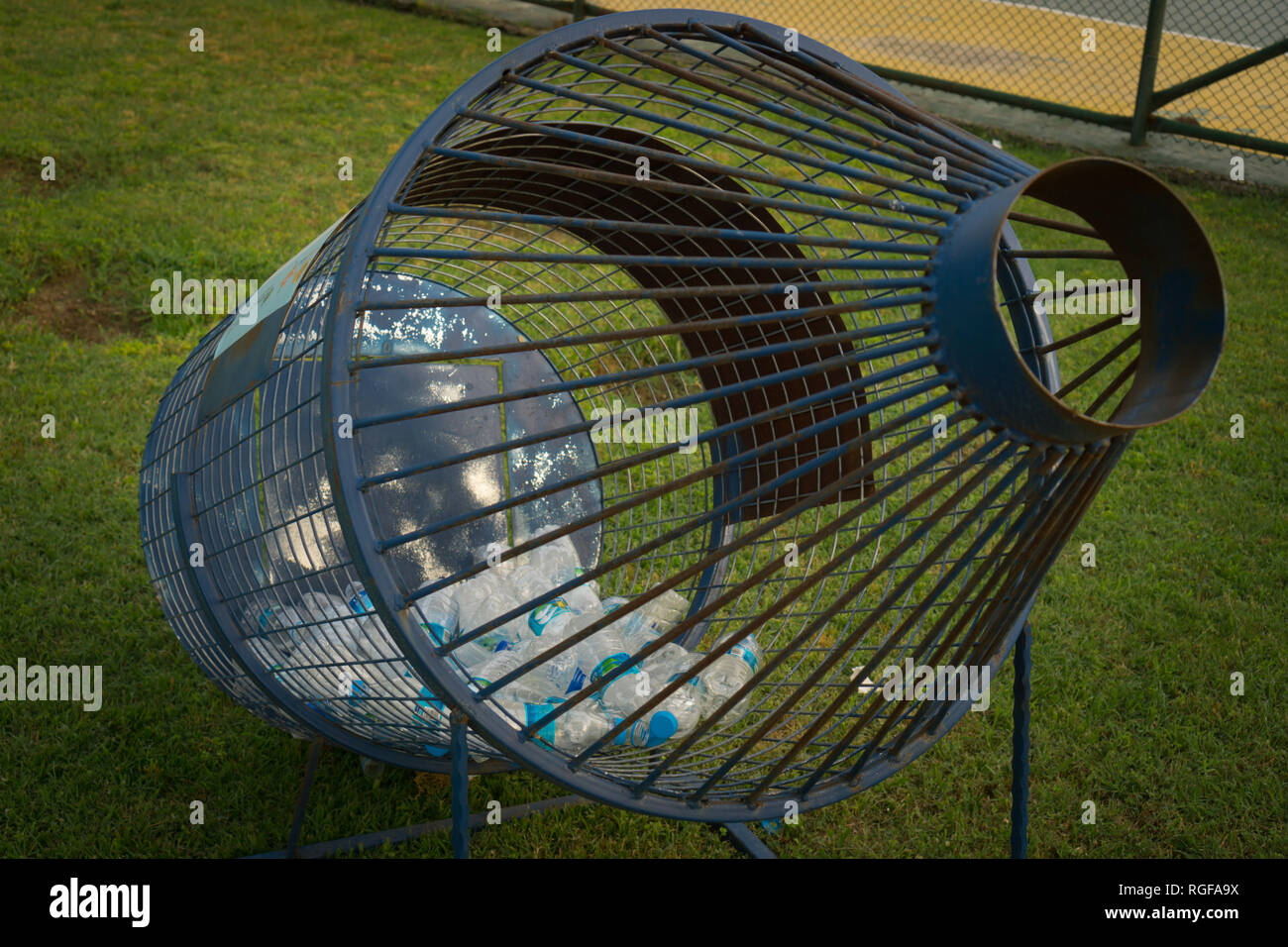 Empty plastic bottles gathered for recycling in steel cage in shape of ...