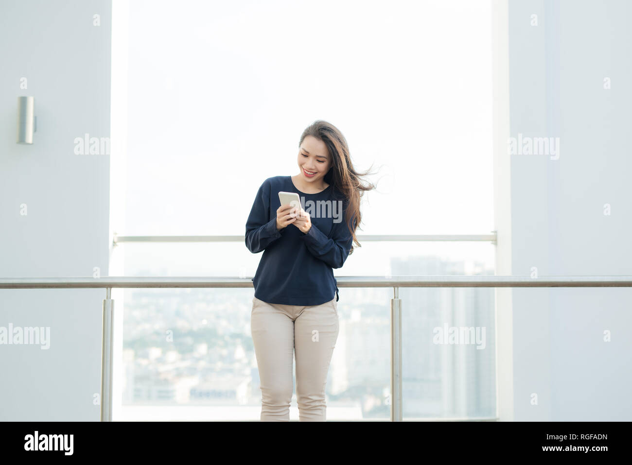 Summer in the city. Pretty young woman with smartphone outdoors Stock ...