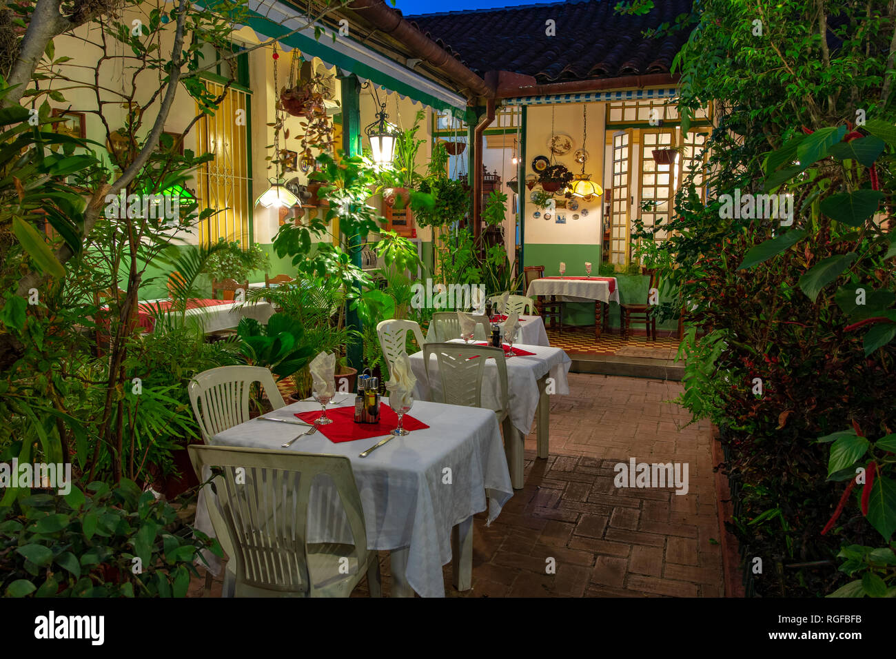 Patio and corridor of a colonial house with tables in the garden Stock ...