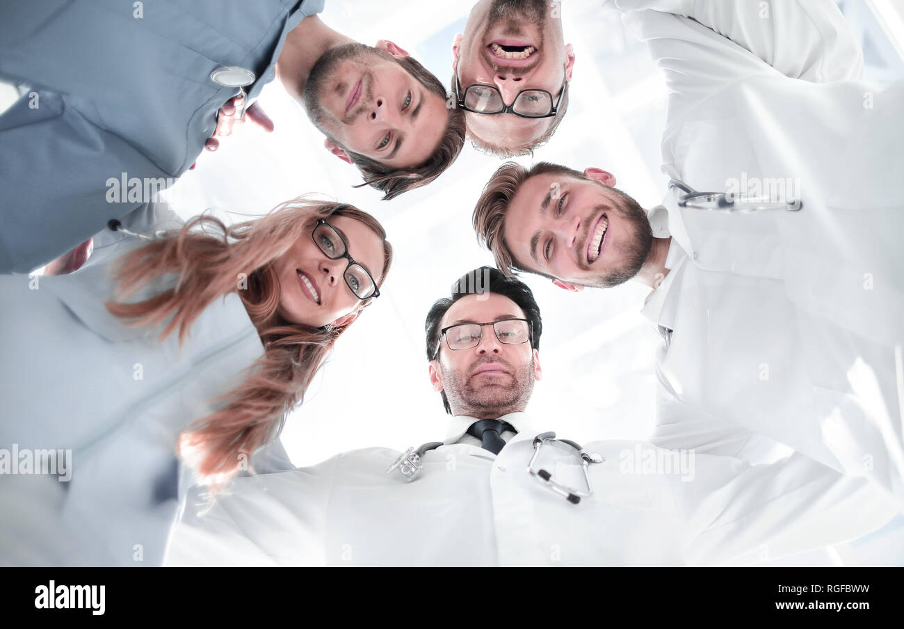 doctors looking down smiling at the camera Stock Photo - Alamy