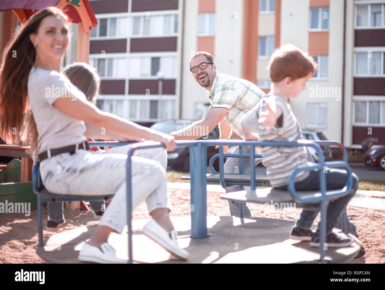 modern young family with children playing in the Playground Stock Photo ...